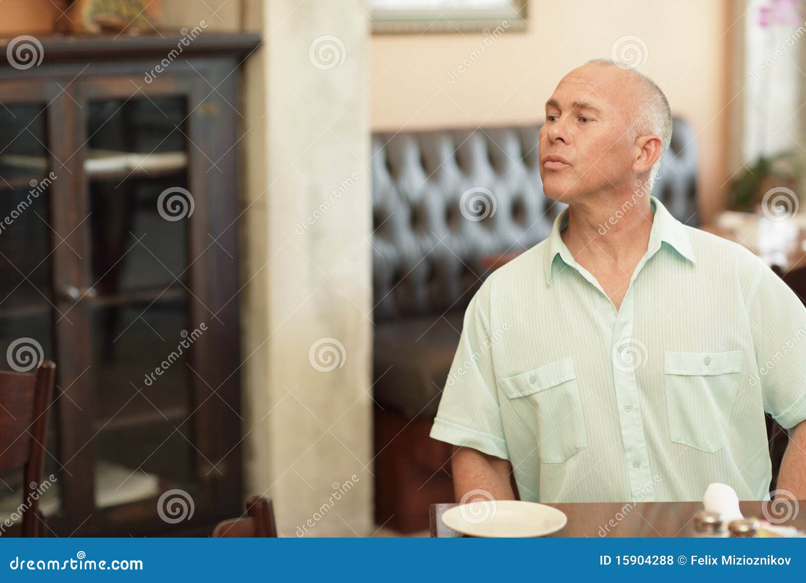 Man sitting and glancing stock photo. Image of adult - 15904288
