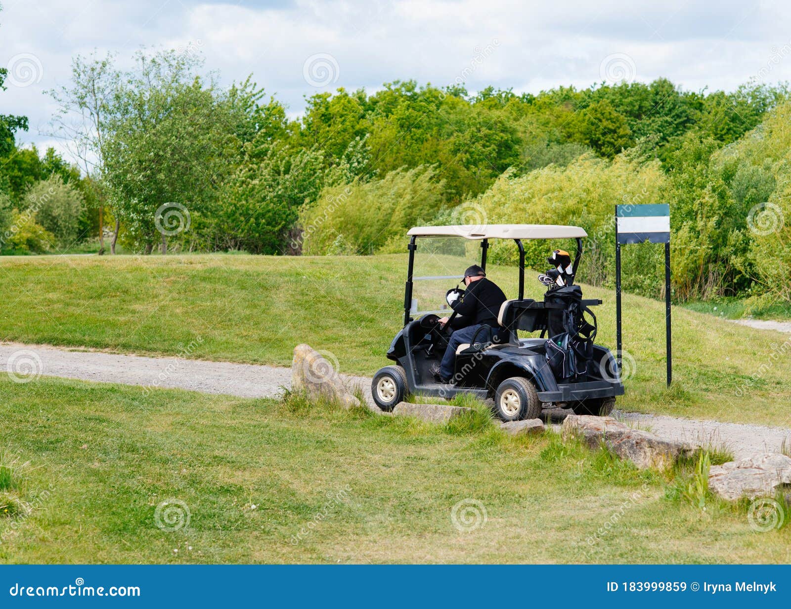 Man Sitting on Golf Cart on the Golf Course Editorial Stock Image ...