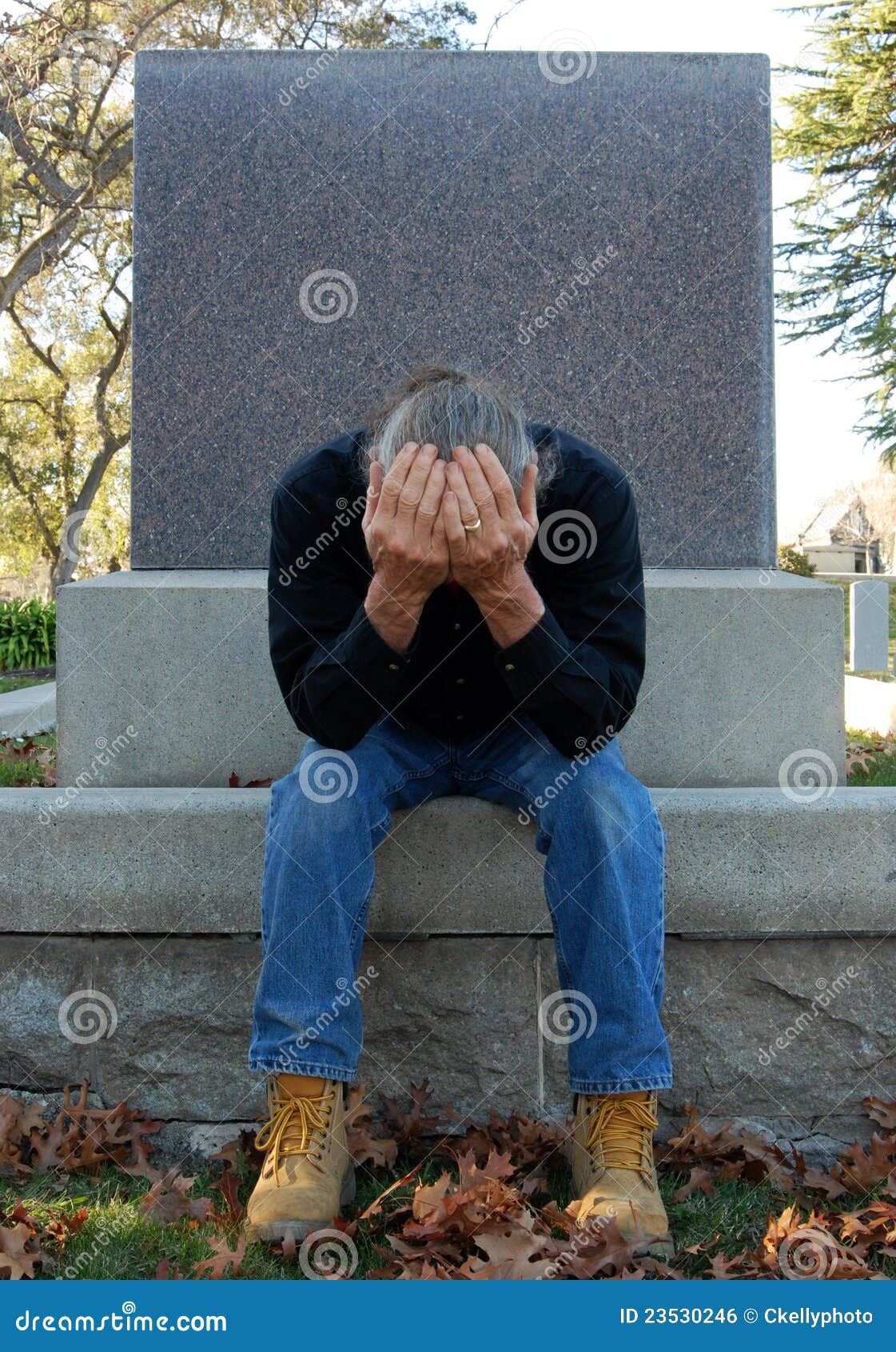Man sitting at gravesite stock photo. Image of adjust - 23530246