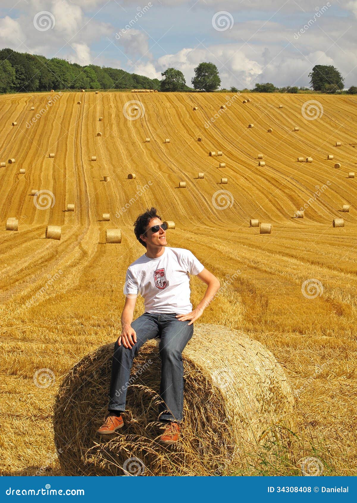 Man sitting on hay bale stock photo. Image of straw, idyllic - 34308408