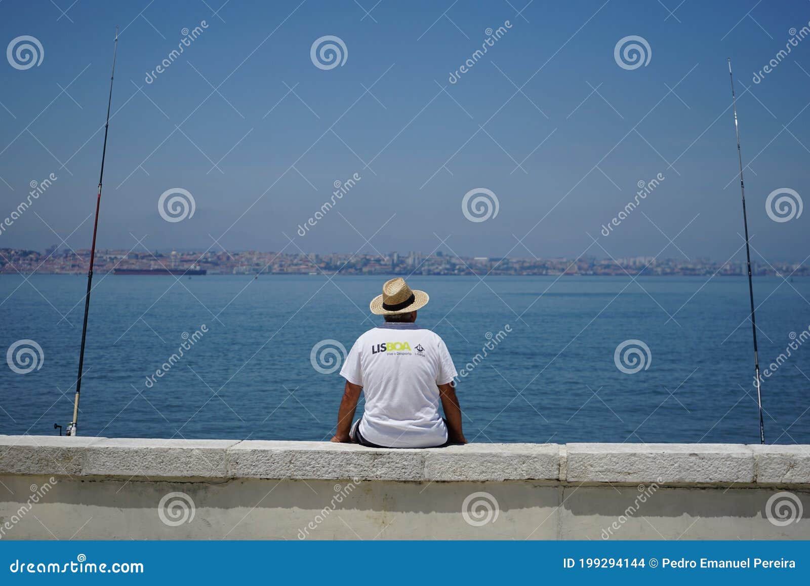 Man Sitting on His Back Watching the River and the City of Lisbon ...