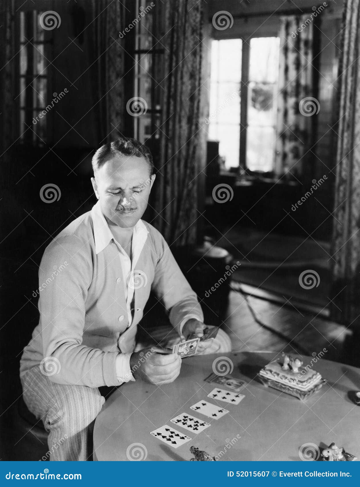 Man Sitting in His Living Room Playing Cards Stock Image - Image of ...