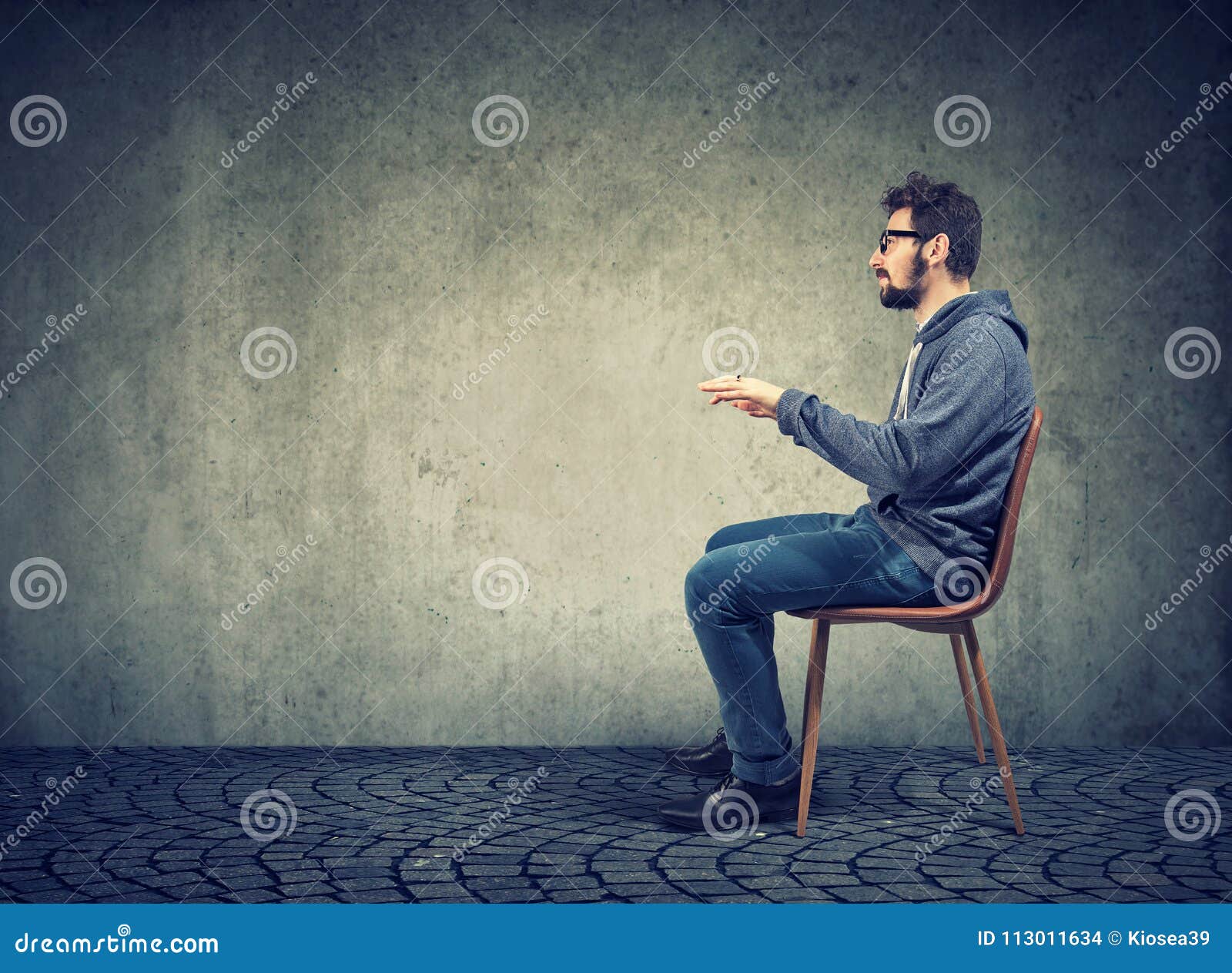 Man Sitting at Imaginary Table Stock Photo - Image of benefit ...