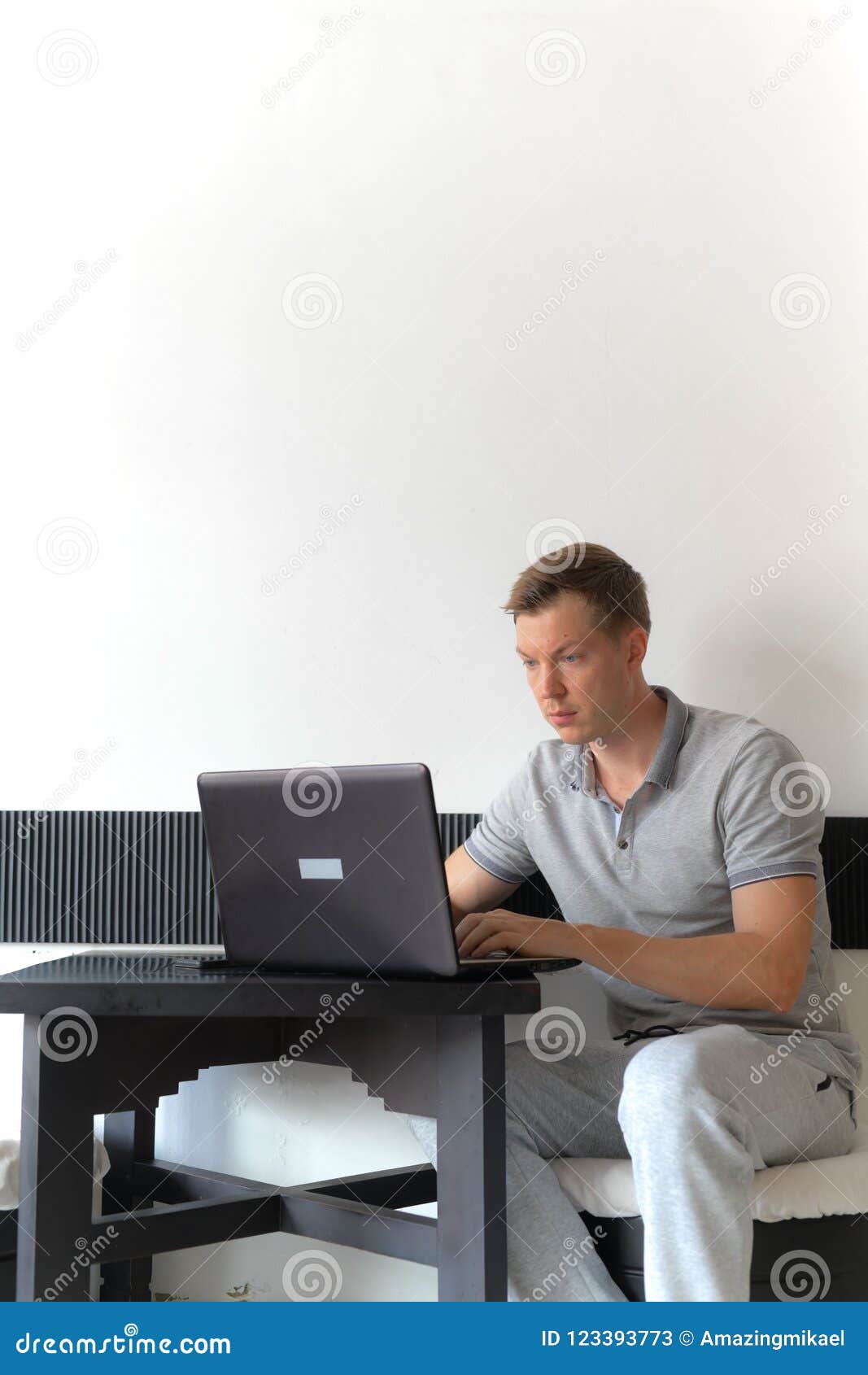 Man Sitting Indoors while Using Laptop Computer Stock Image - Image of ...