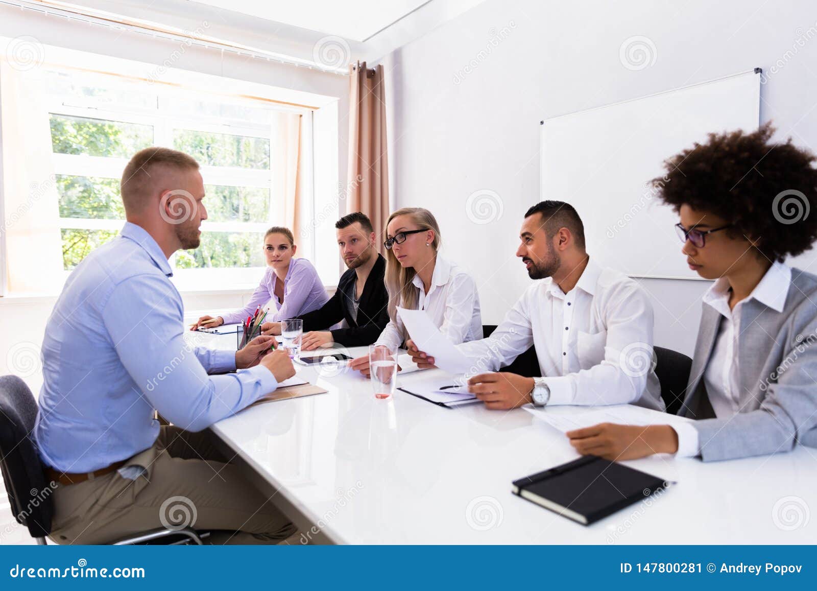 Man Sitting at Interview stock image. Image of african - 147800281