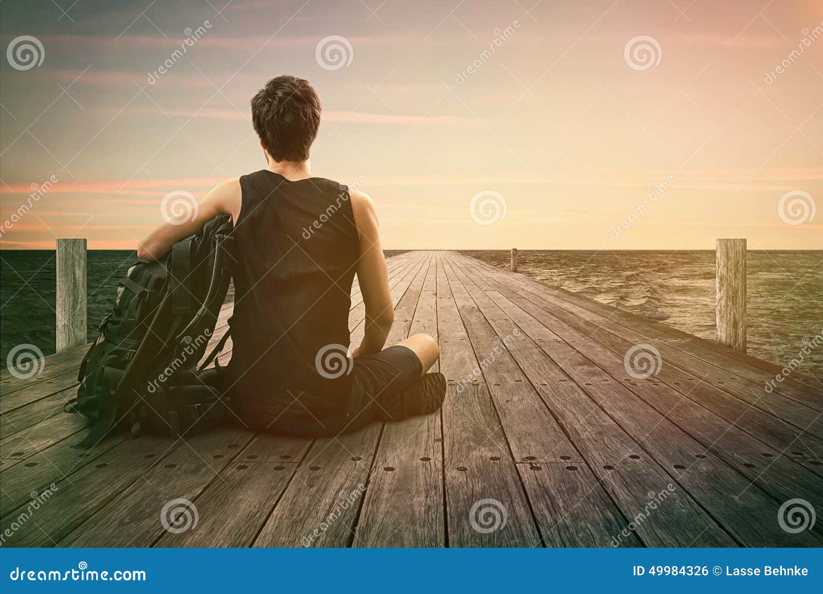 Man sitting on a Jetty stock photo. Image of distant - 49984326