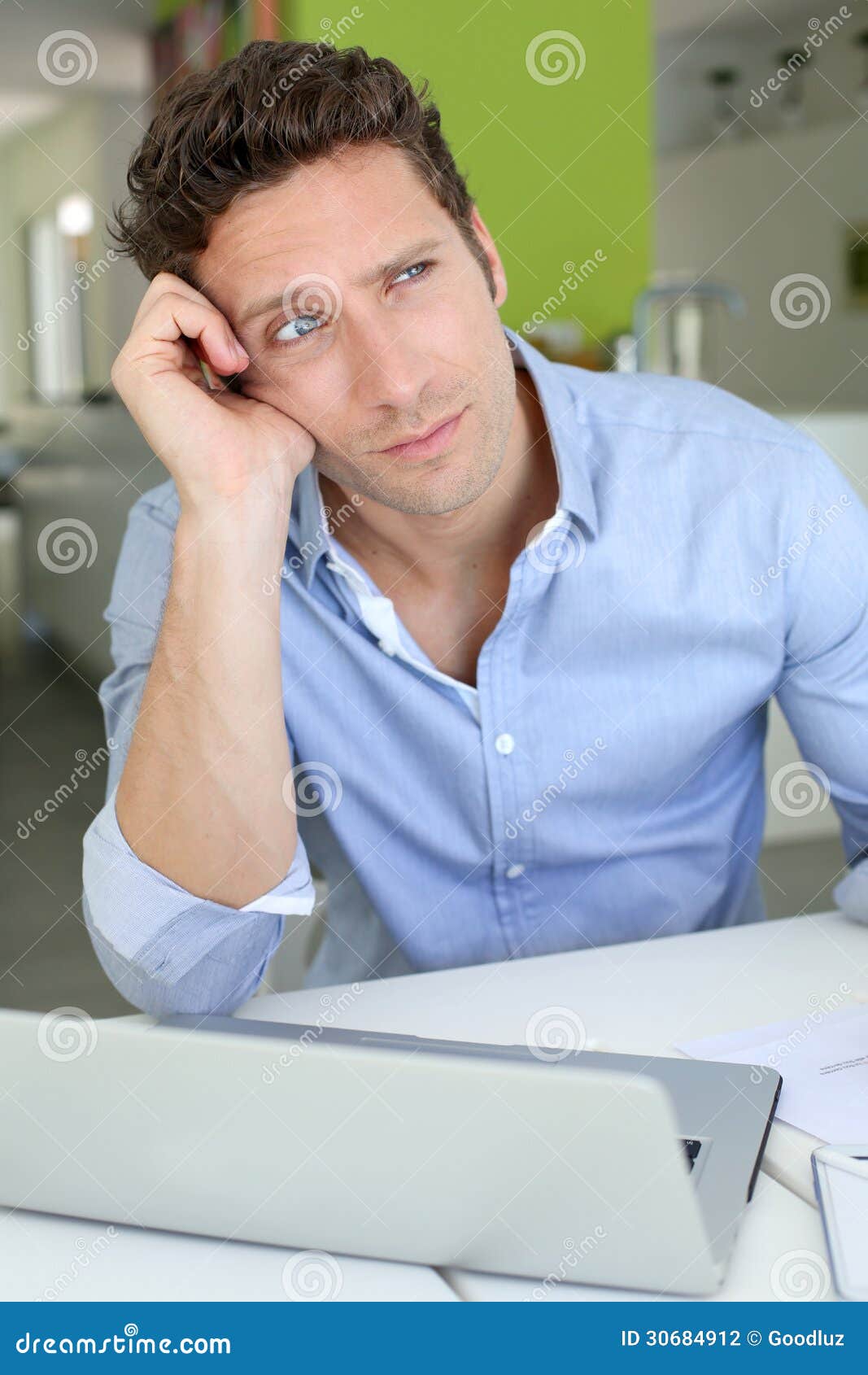 Man Sitting in Kitchen with a Displeased Look Stock Photo - Image of ...