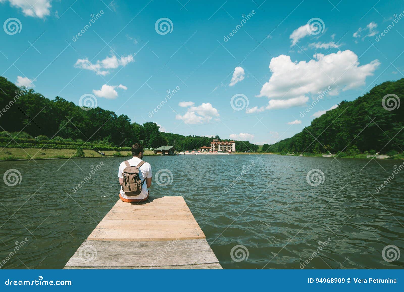 Man sitting on a lake pier stock image. Image of relaxation - 94968909