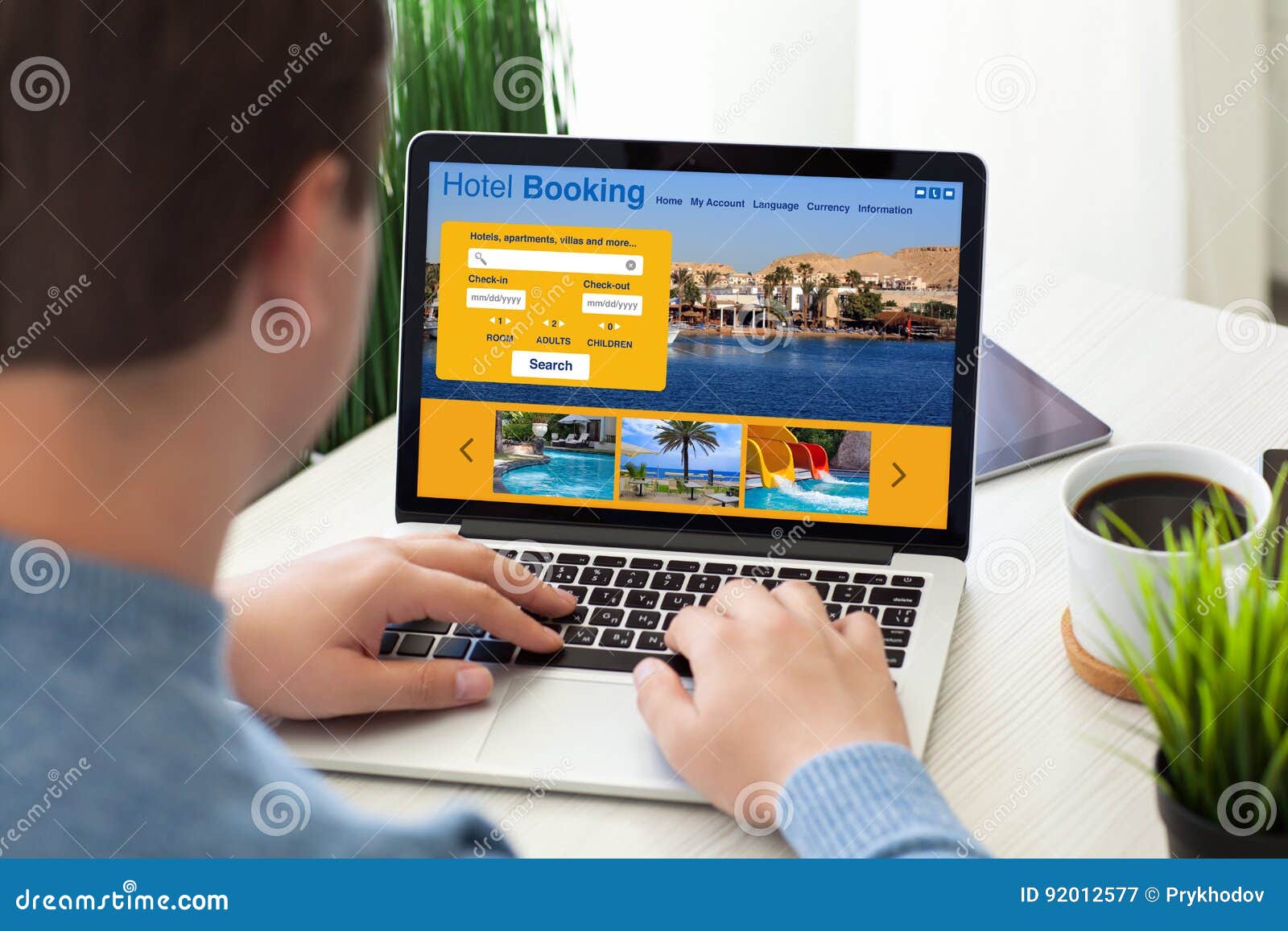 Man Sitting with Laptop Computer with Hotel Booking on Screen Stock ...