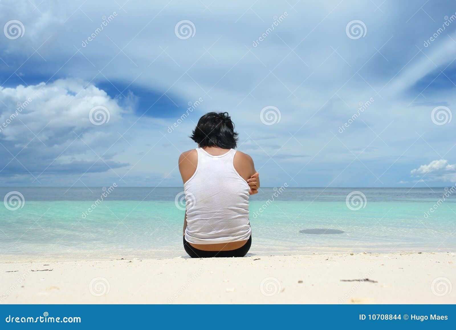 Man Sitting Lonely on Beach Stock Photo - Image of exotic, longing ...