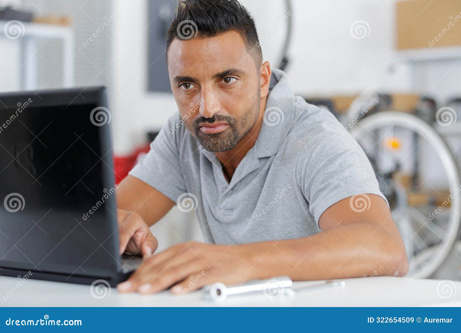 Man Sitting at Modern Office Using Laptop Stock Image - Image of ...