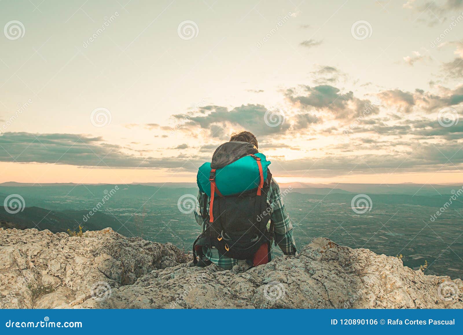 Man sitting on a mountain stock photo. Image of explorer - 120890106