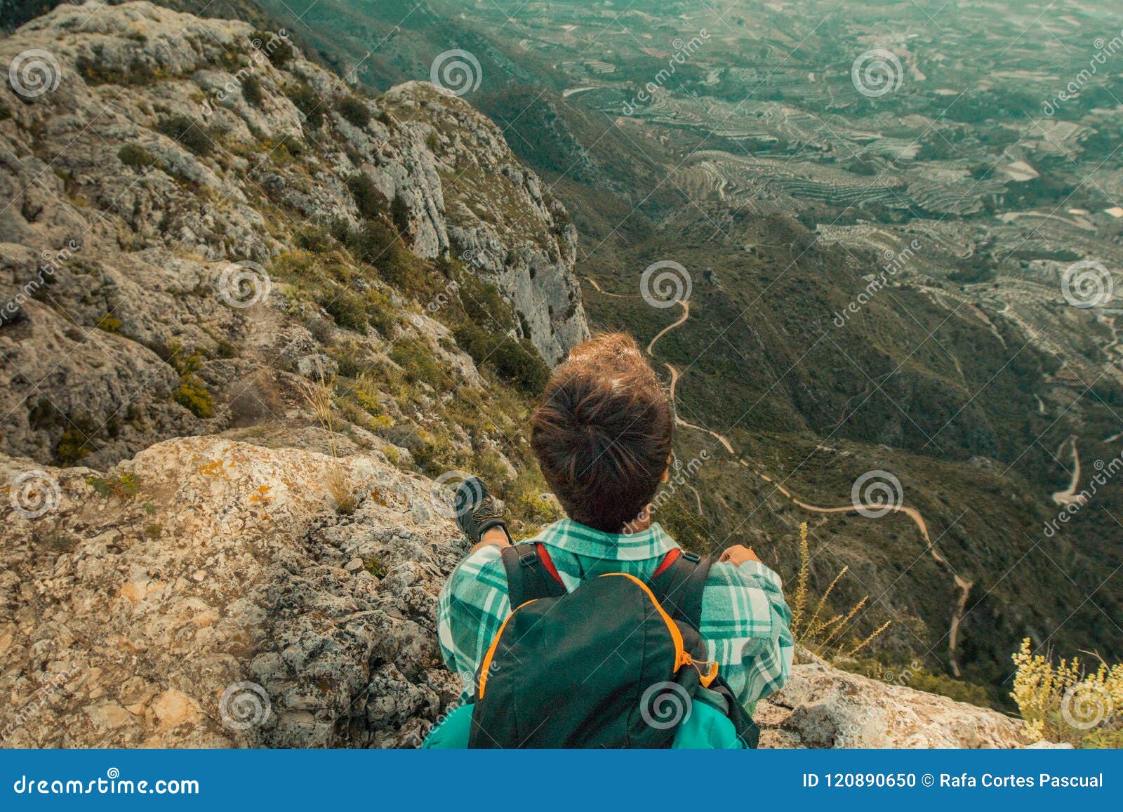Man sitting on a mountain stock photo. Image of hiking - 120890650
