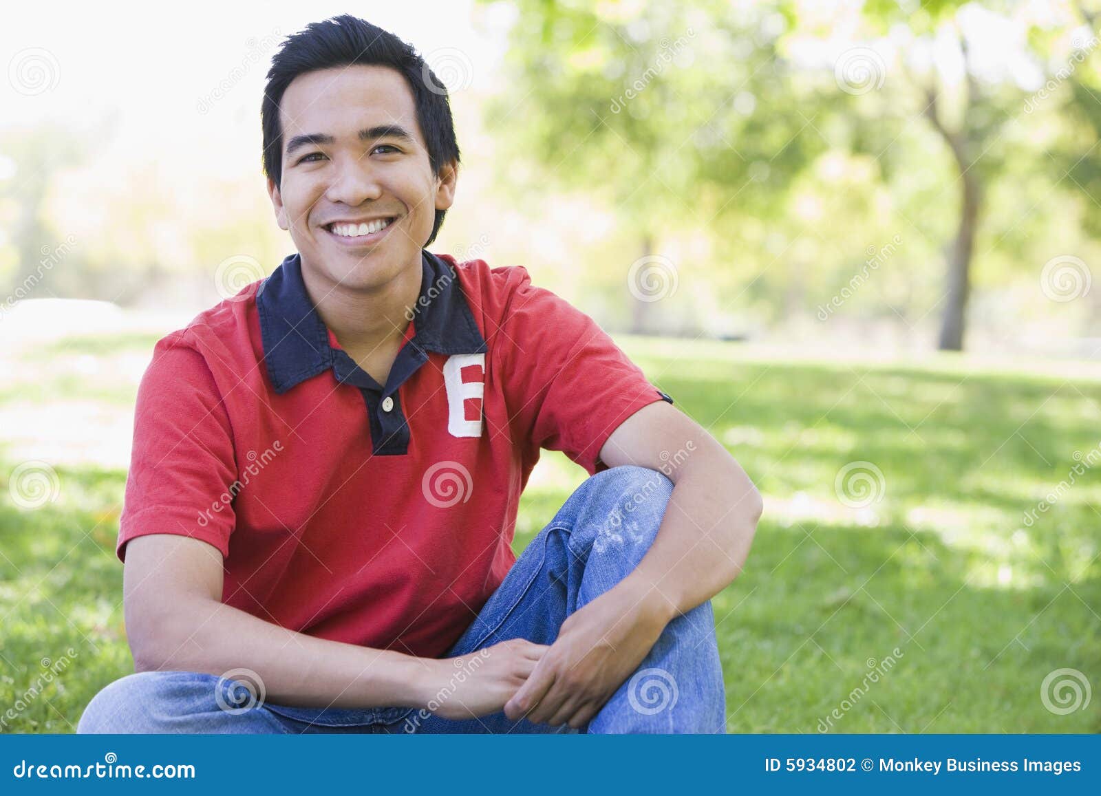 Man Sitting Outdoors Smiling Stock Photo - Image of camera, lifestyle ...