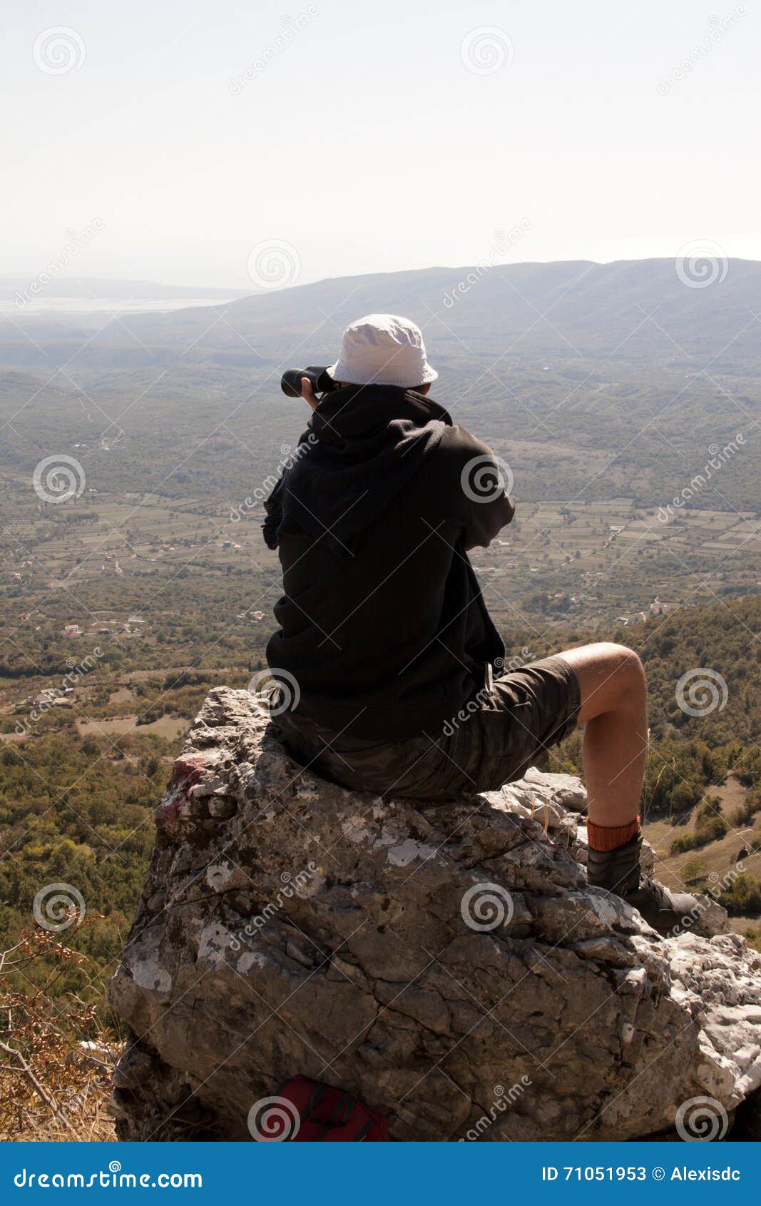 Man sitting outside stock image. Image of cliff, environment - 71051953