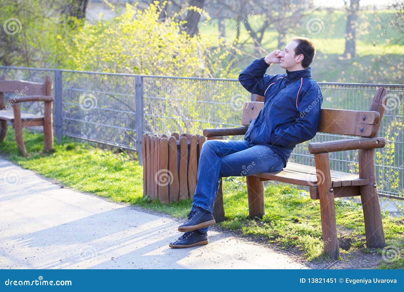 Man Sitting on a Park Bench Stock Image - Image of serene, relaxation ...