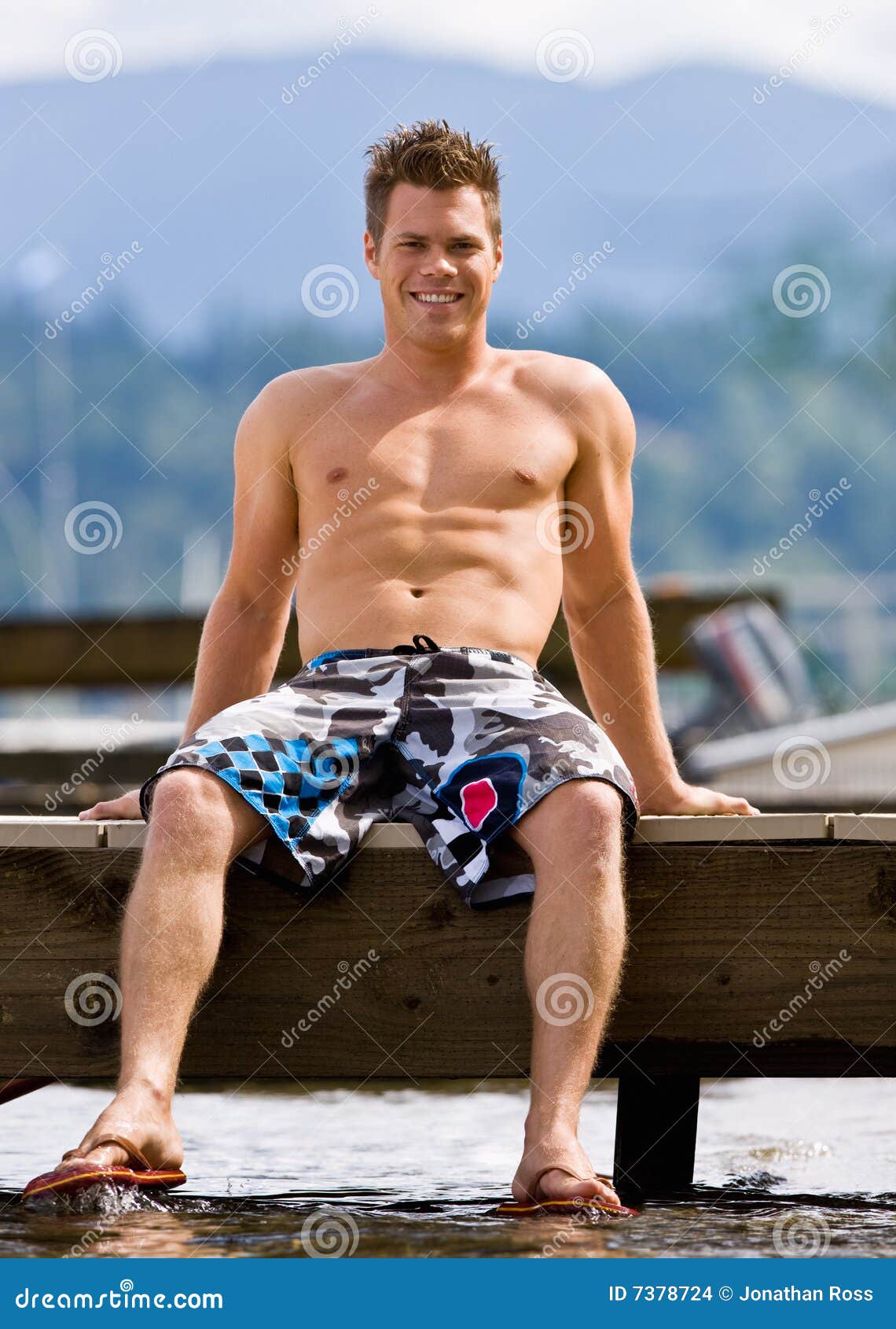 Man sitting on pier stock photo. Image of caucasian, shirtless - 7378724