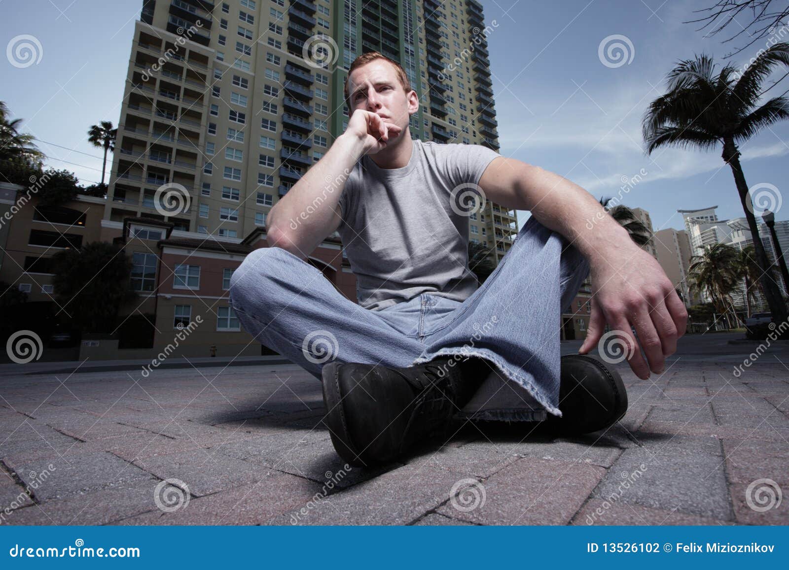 Man sitting and pondering stock photo. Image of angle - 13526102