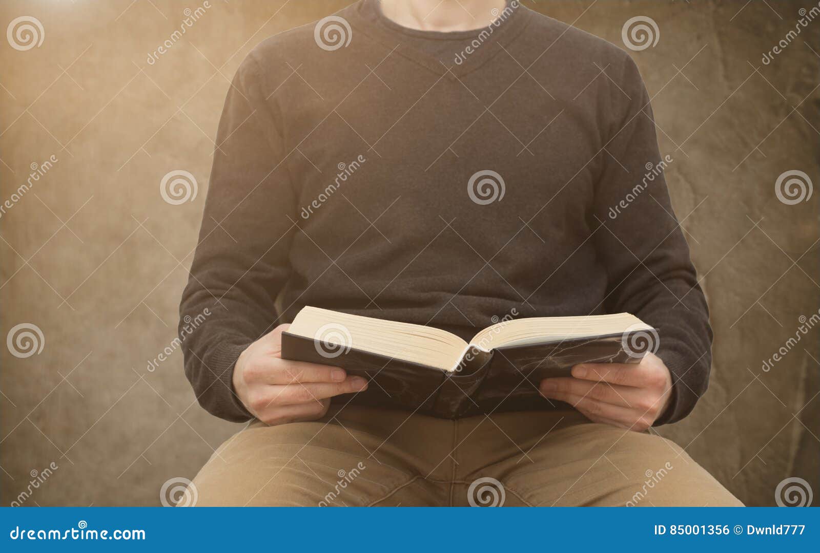 Man Sitting and Reading Book Stock Photo - Image of books, novel: 85001356