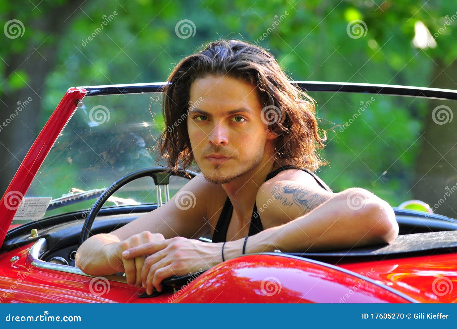Man sitting in a red car stock photo. Image of cute, vehicle - 17605270