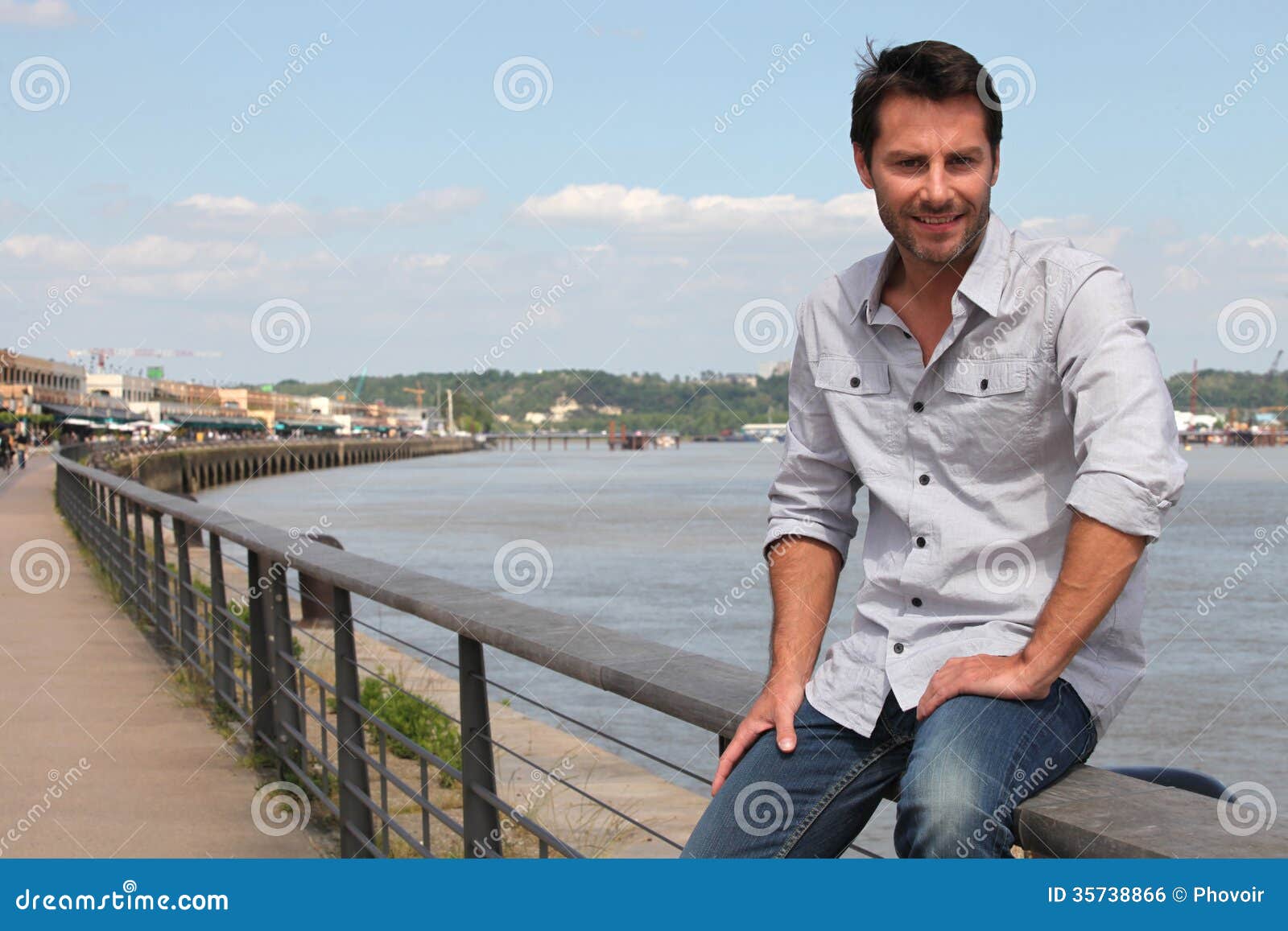 Man sitting by river. stock photo. Image of person, 3035 - 35738866