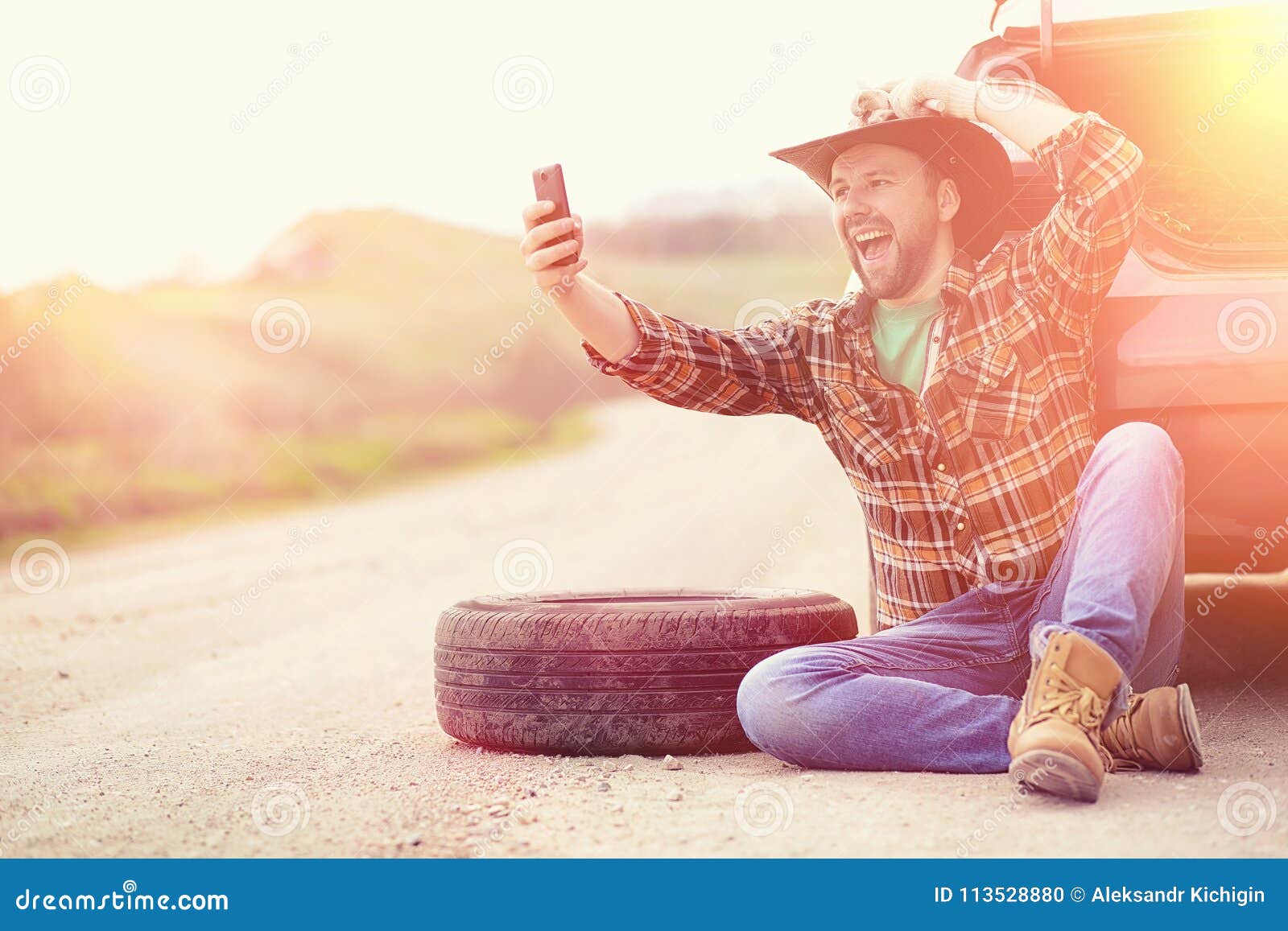 Man is Sitting on the Road by the Car Stock Photo - Image of assistance ...