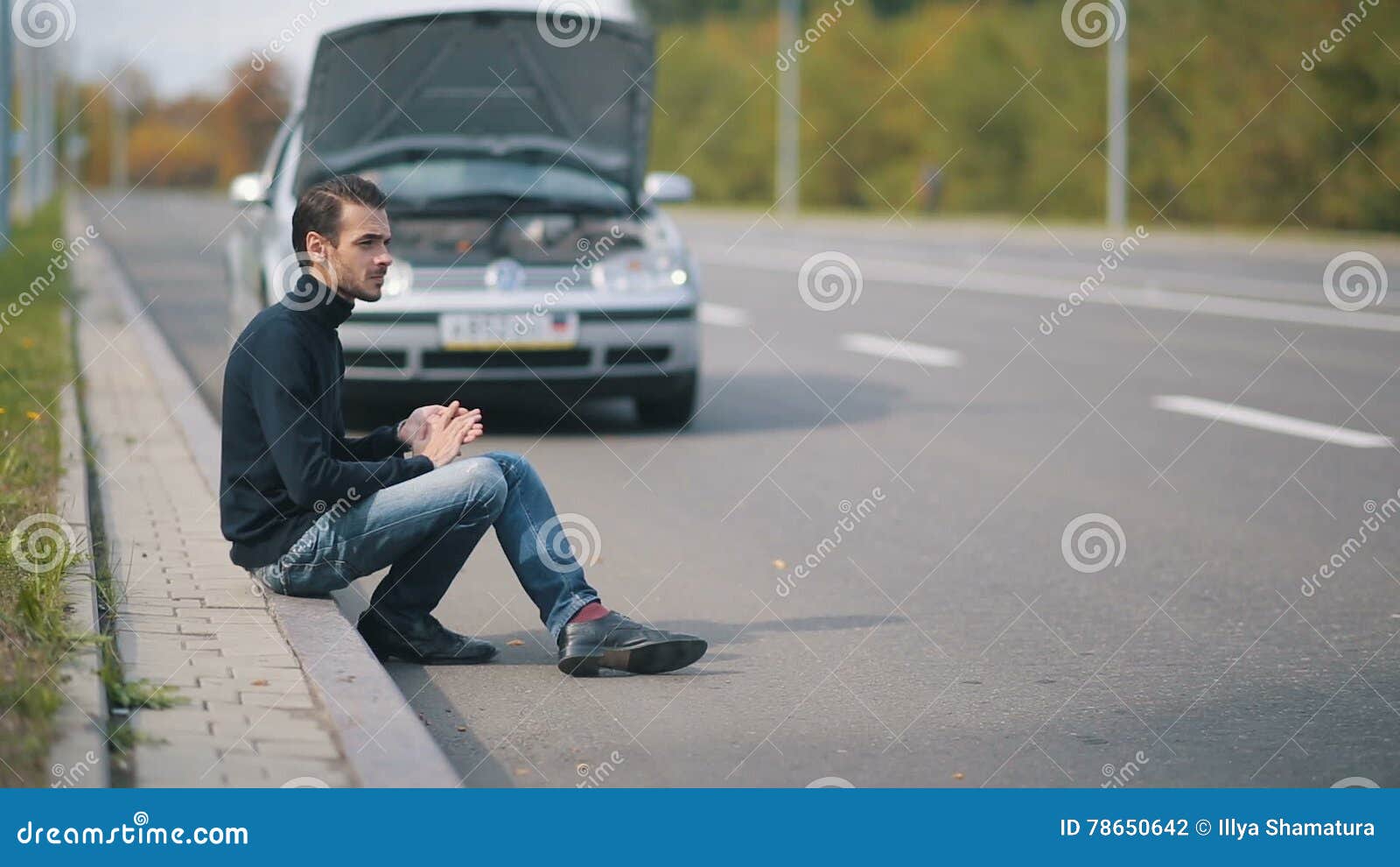 Man Sitting on the Road in a Front of Broken Car Stock Footage - Video ...