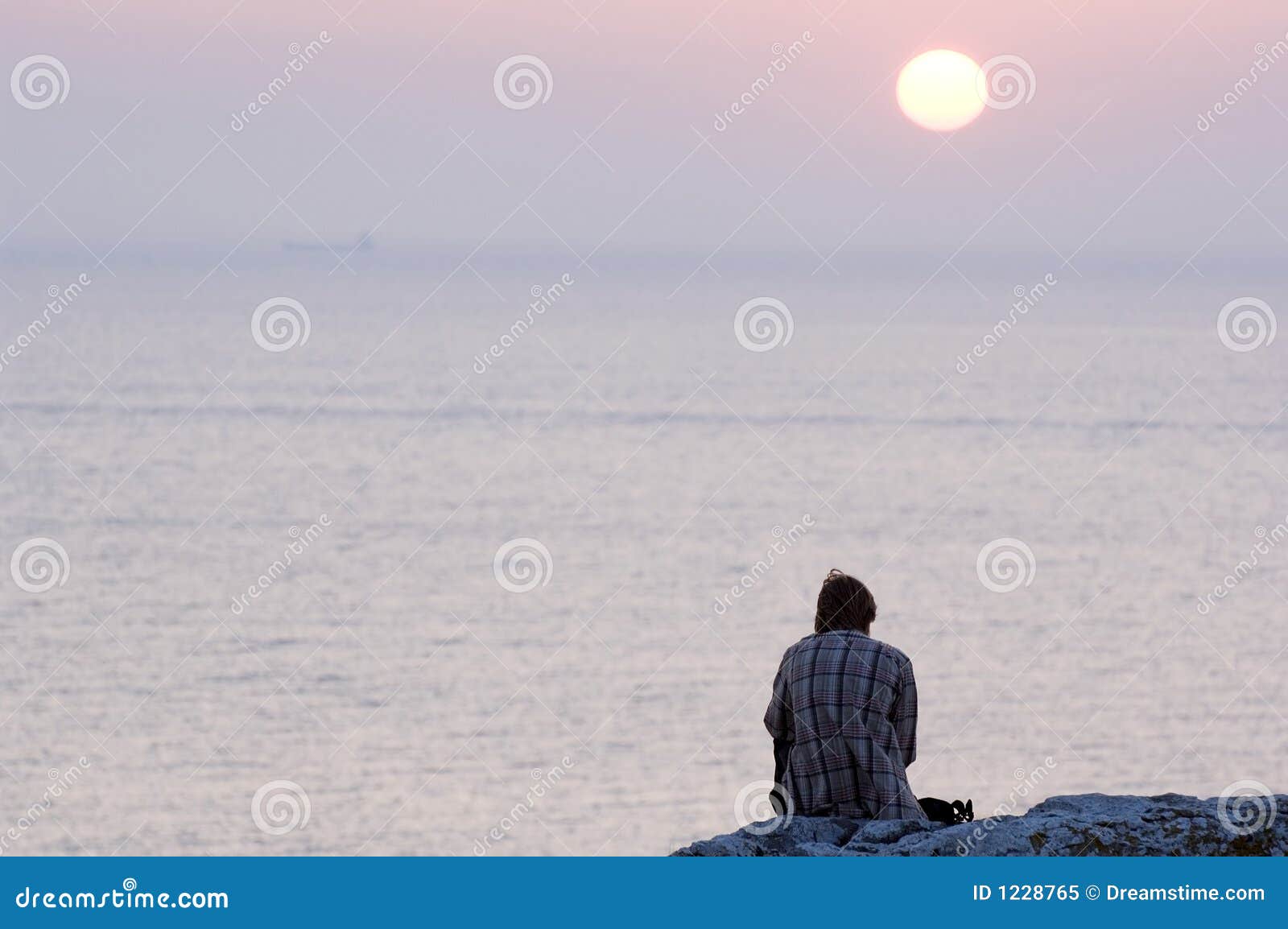 Man sitting on a rock stock image. Image of beautiful - 1228765
