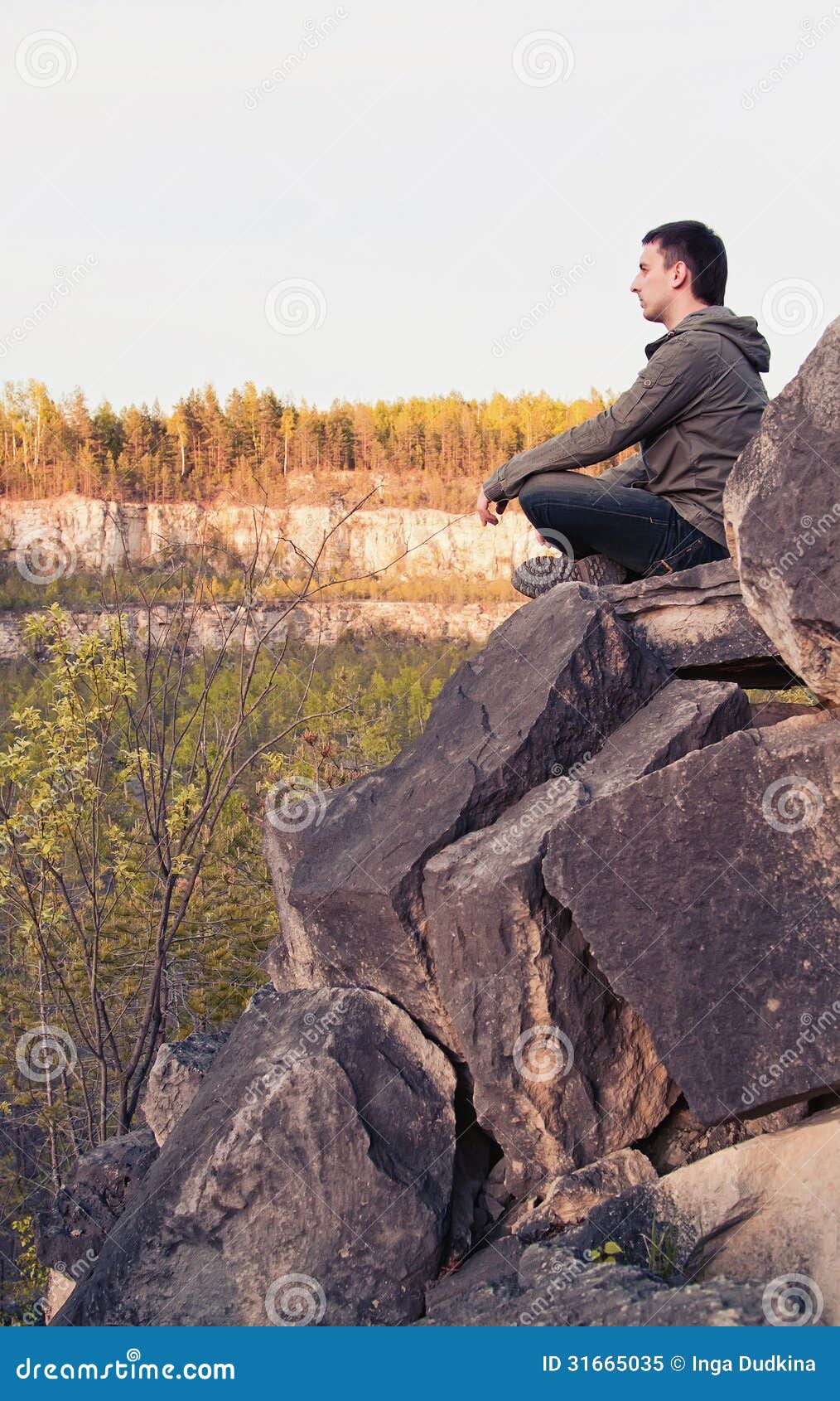 Man sitting on rock stock image. Image of hike, sportsman - 31665035