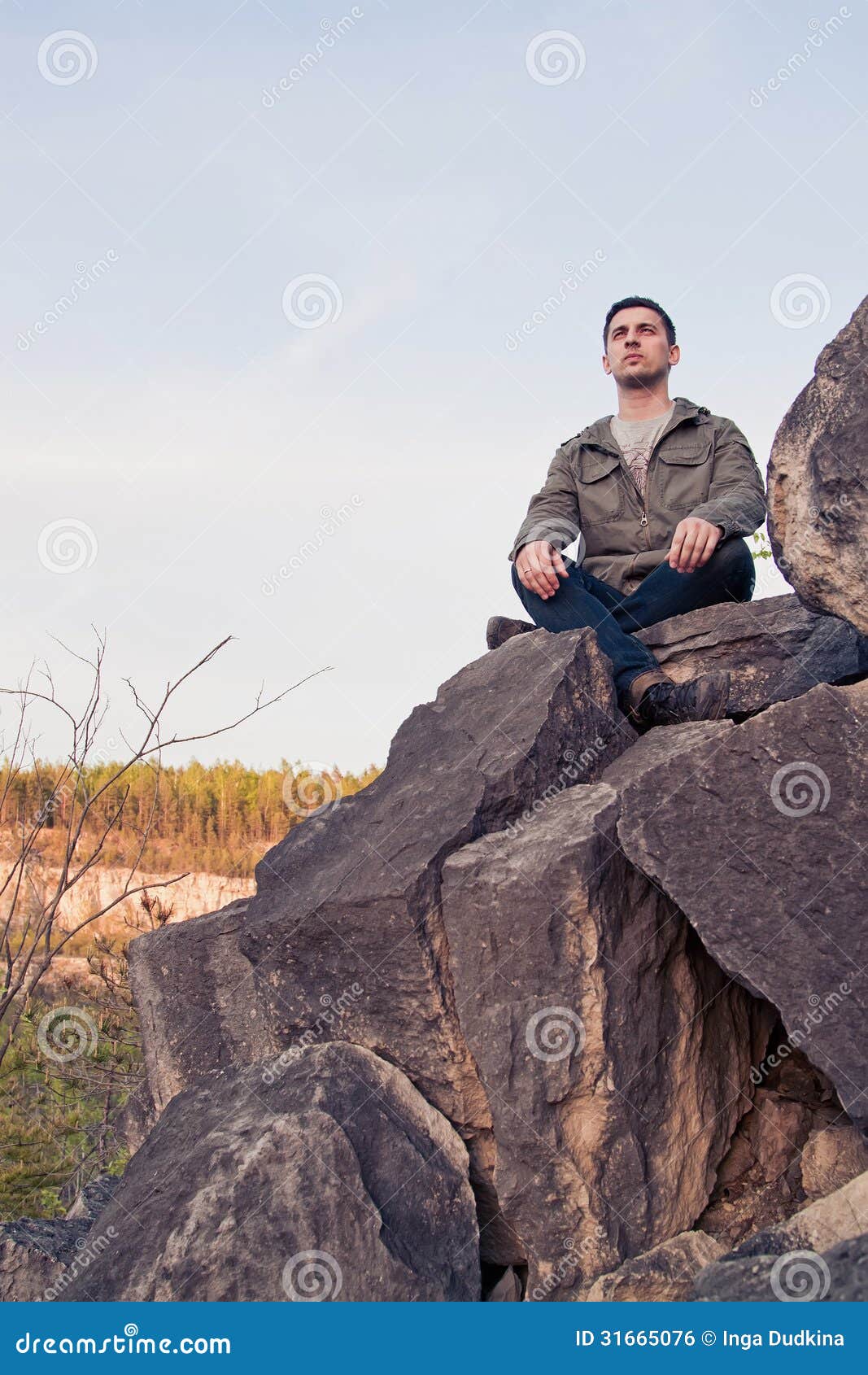 Man sitting on rock stock photo. Image of sitting, trekking - 31665076