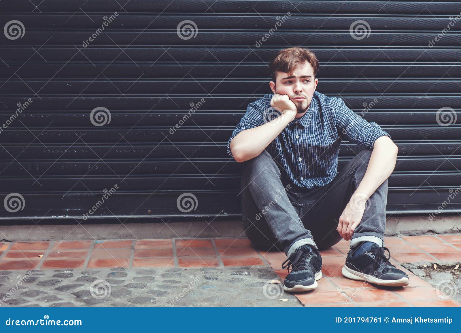 Man sitting sad alone stock image. Image of grief, emotion - 201794761