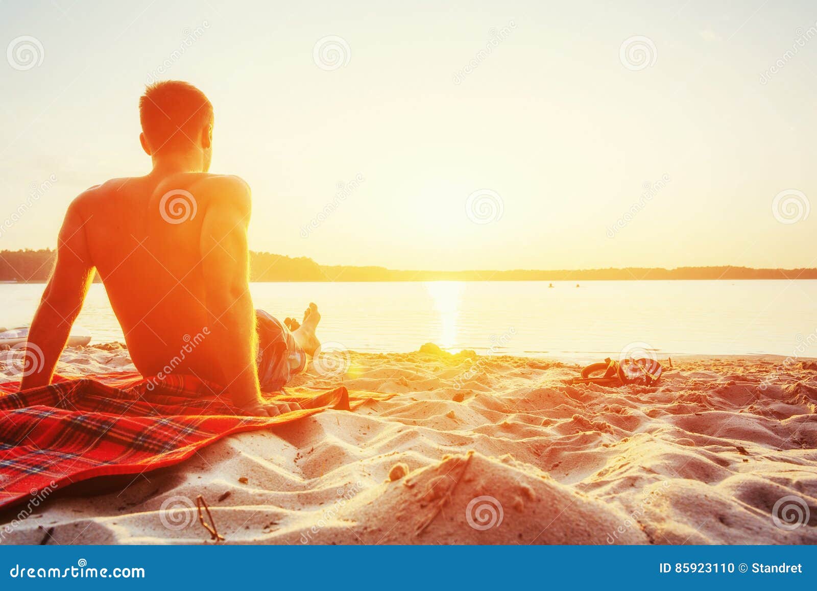 Man Sitting on the Sand at Sunset Stock Photo - Image of relationship ...