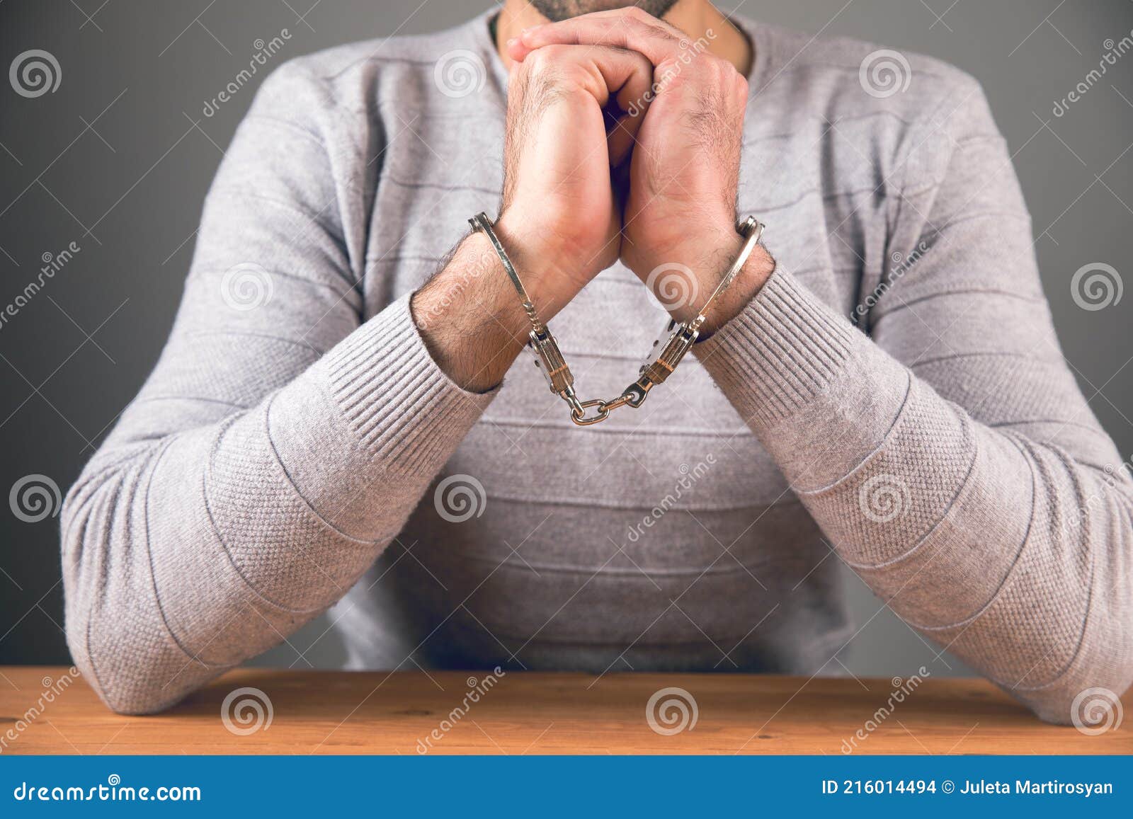 Man sitting in shackles stock photo. Image of captivity - 216014494