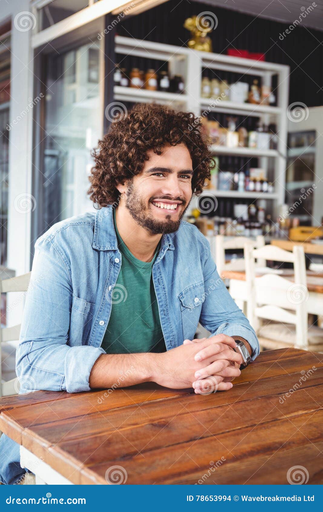 Man sitting and smiling stock photo. Image of cheerful - 78653994