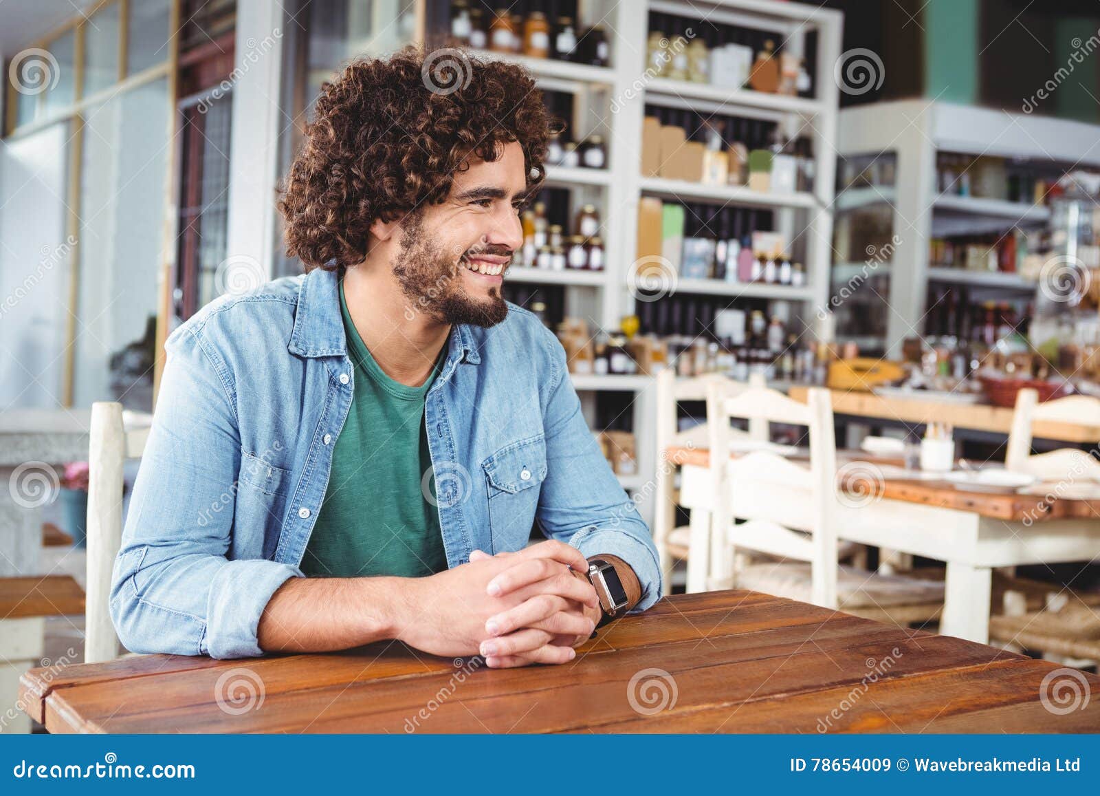 Man sitting and smiling stock image. Image of casual - 78654009