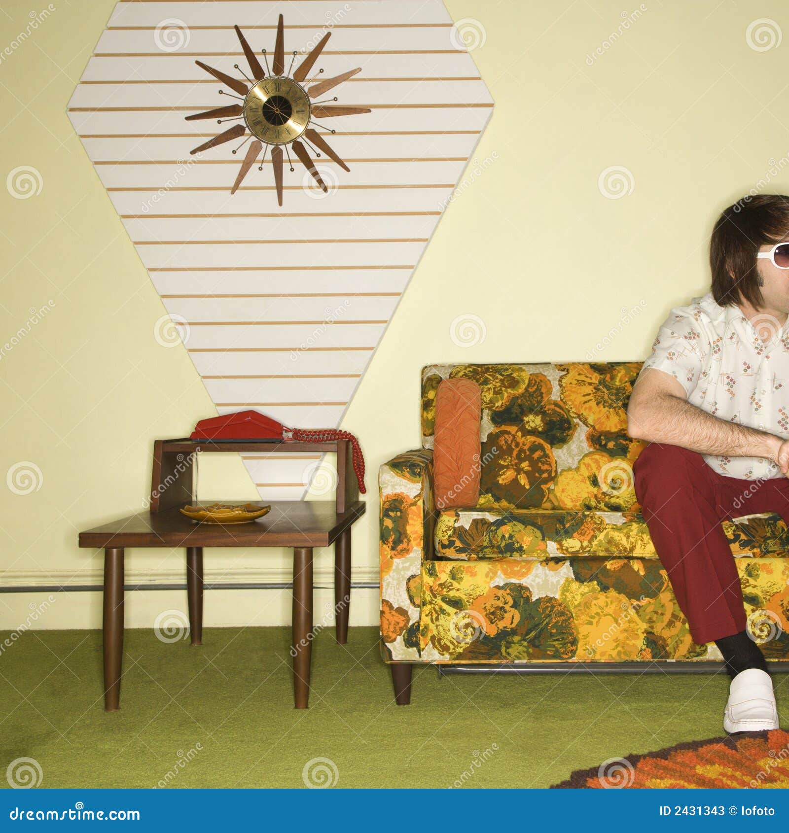 Man sitting on sofa. stock image. Image of sixties, color - 2431343