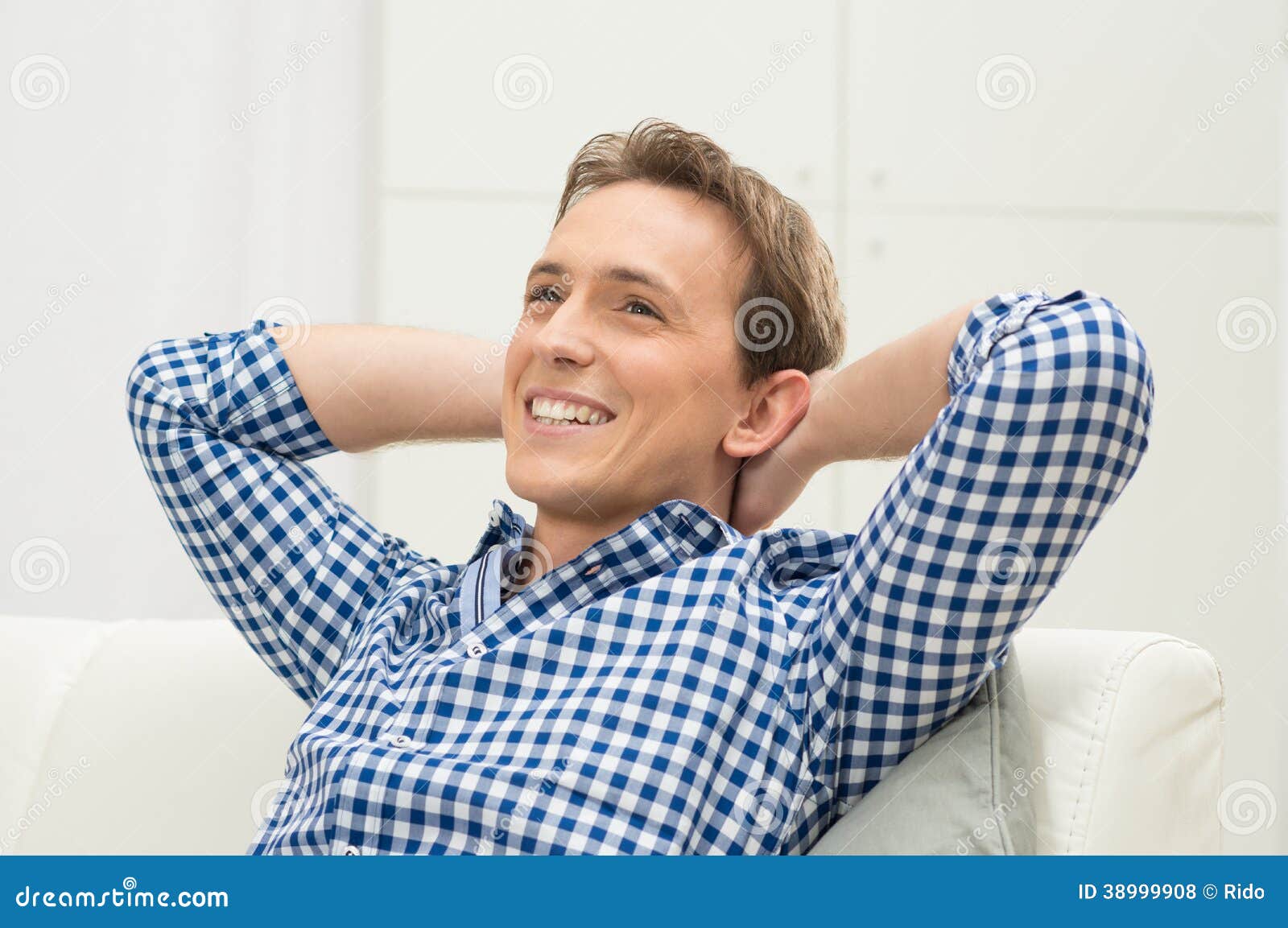Man Sitting on Sofa Contemplating Stock Photo - Image of joyful ...