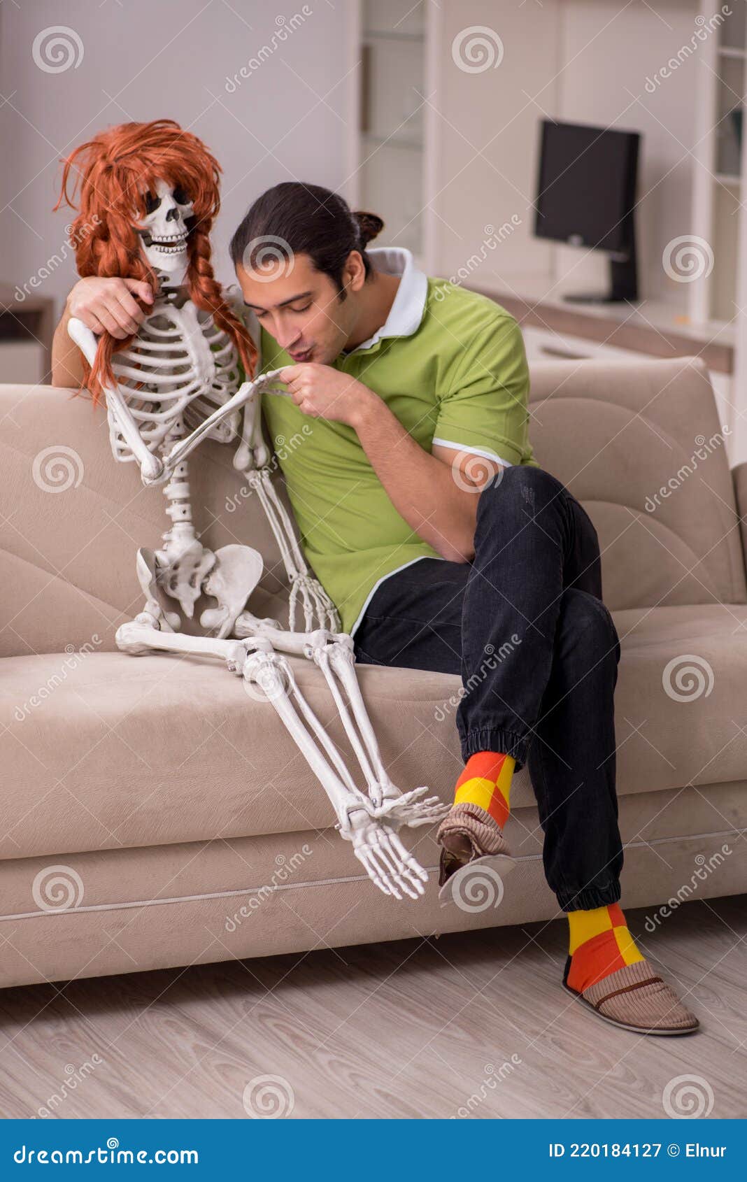 Young Man Sitting on the Sofa with Female Skeleton Stock Image - Image ...