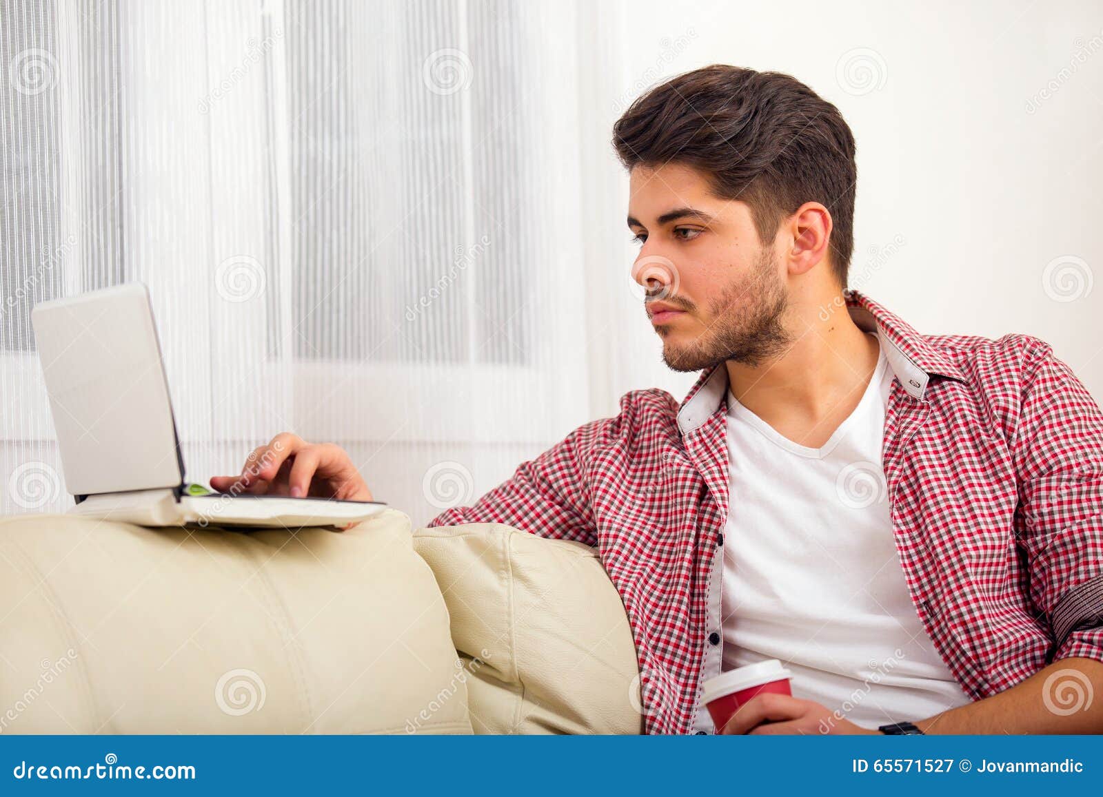 Man Sitting on Sofa with Laptop Stock Image - Image of room, interior ...