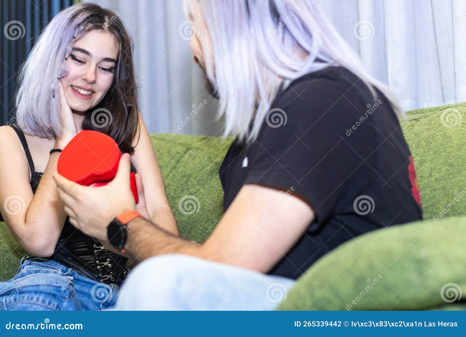 Man Sitting on the Sofa Proposing To His Girlfriend. Stock Photo ... Man Sitting on the Sofa Proposing To His Girlfriend. Stock Photo ...