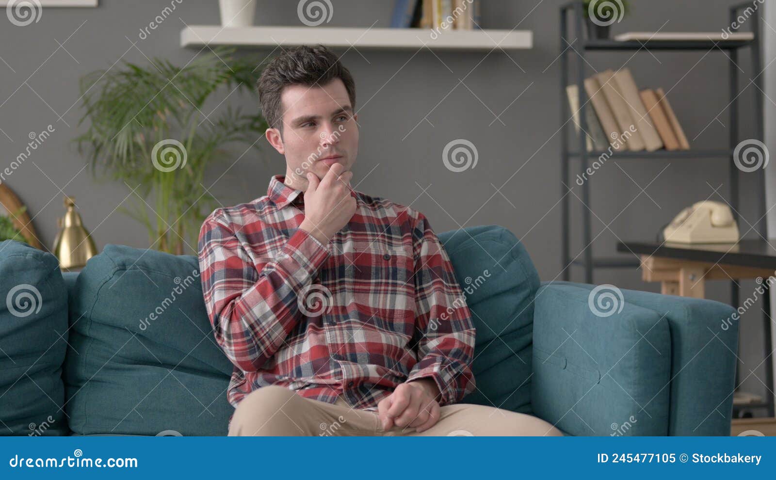 Man Sitting on Sofa Thinking Stock Image - Image of businessman ...
