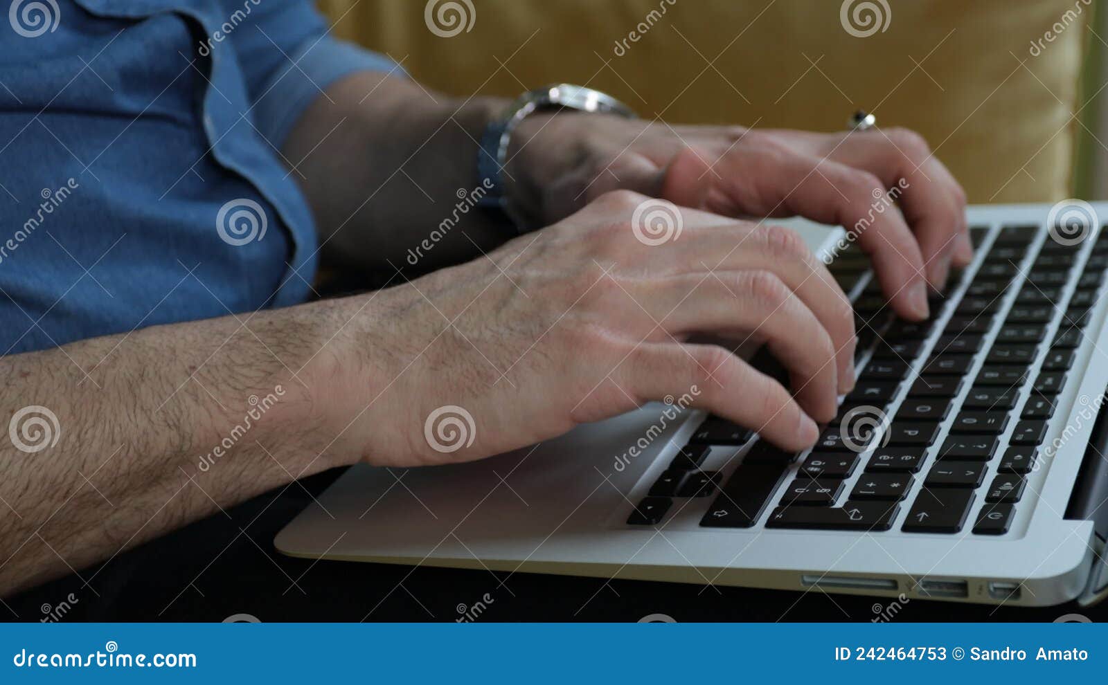Man Sitting on the Sofa Works at the Computer Typing on the Keyboard ...