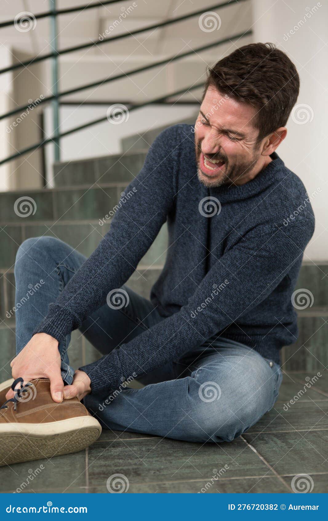 Man Sitting on Staircase after Slip and Fall Accident Stock Photo ...