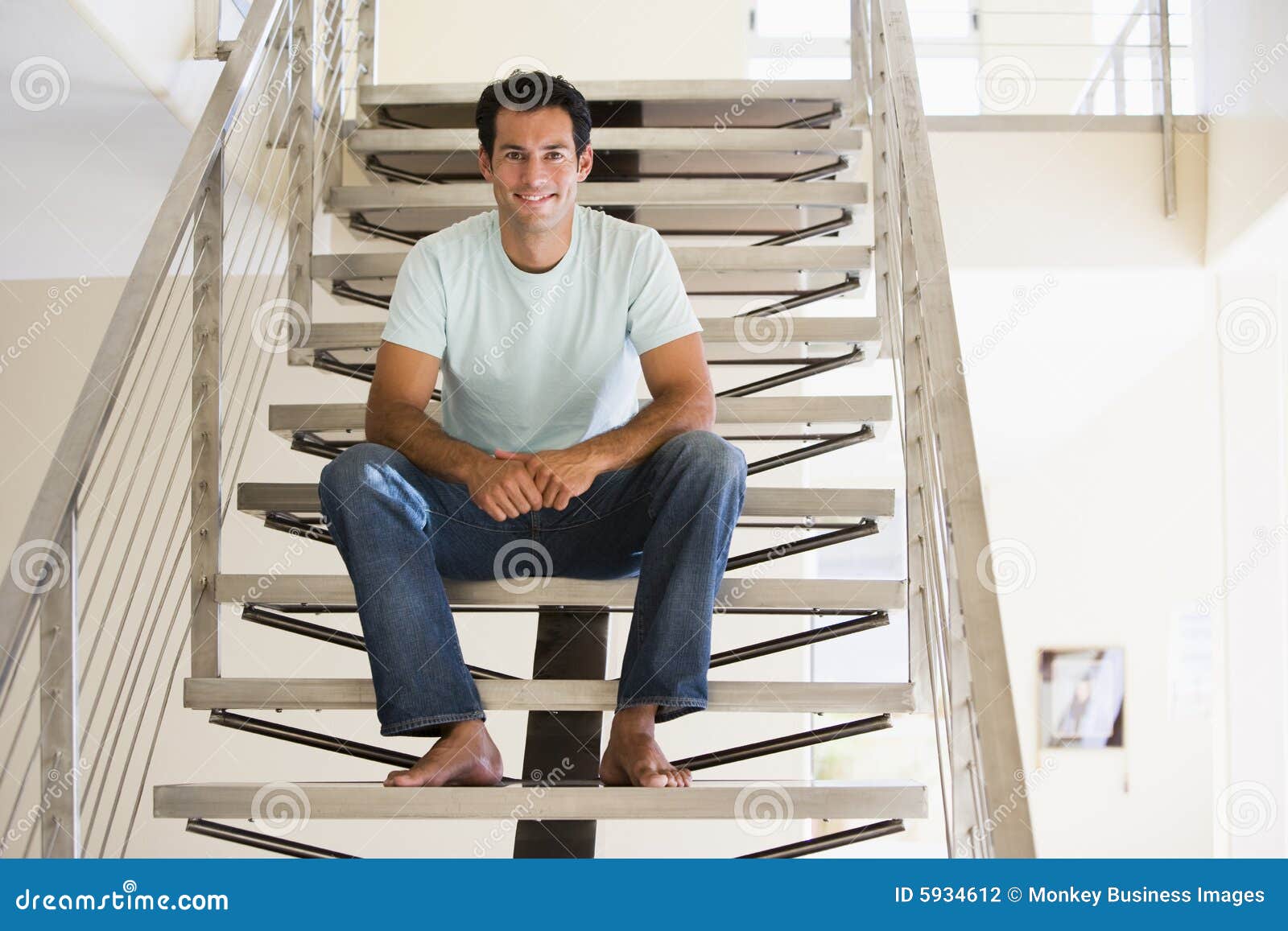 Man Sitting on Staircase Smiling Stock Photo - Image of caucasian ...
