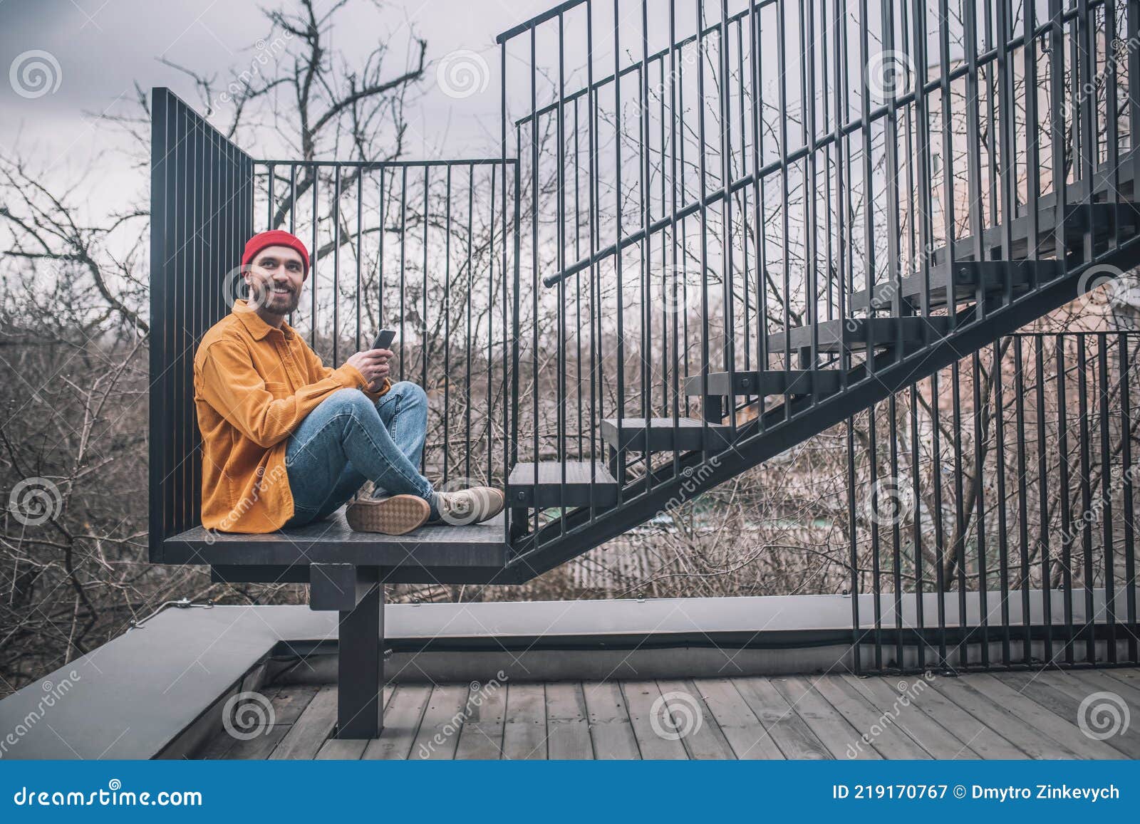 Man Sitting on the Steps of the City Bridge Stock Image - Image of ...