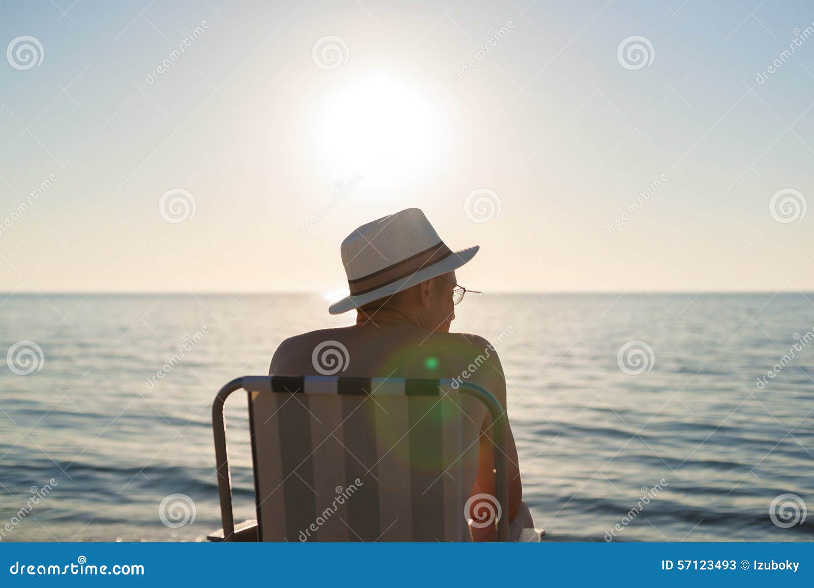 Man Sitting Sunset Beach Backlight Lens Flare Stock Image - Image of ...