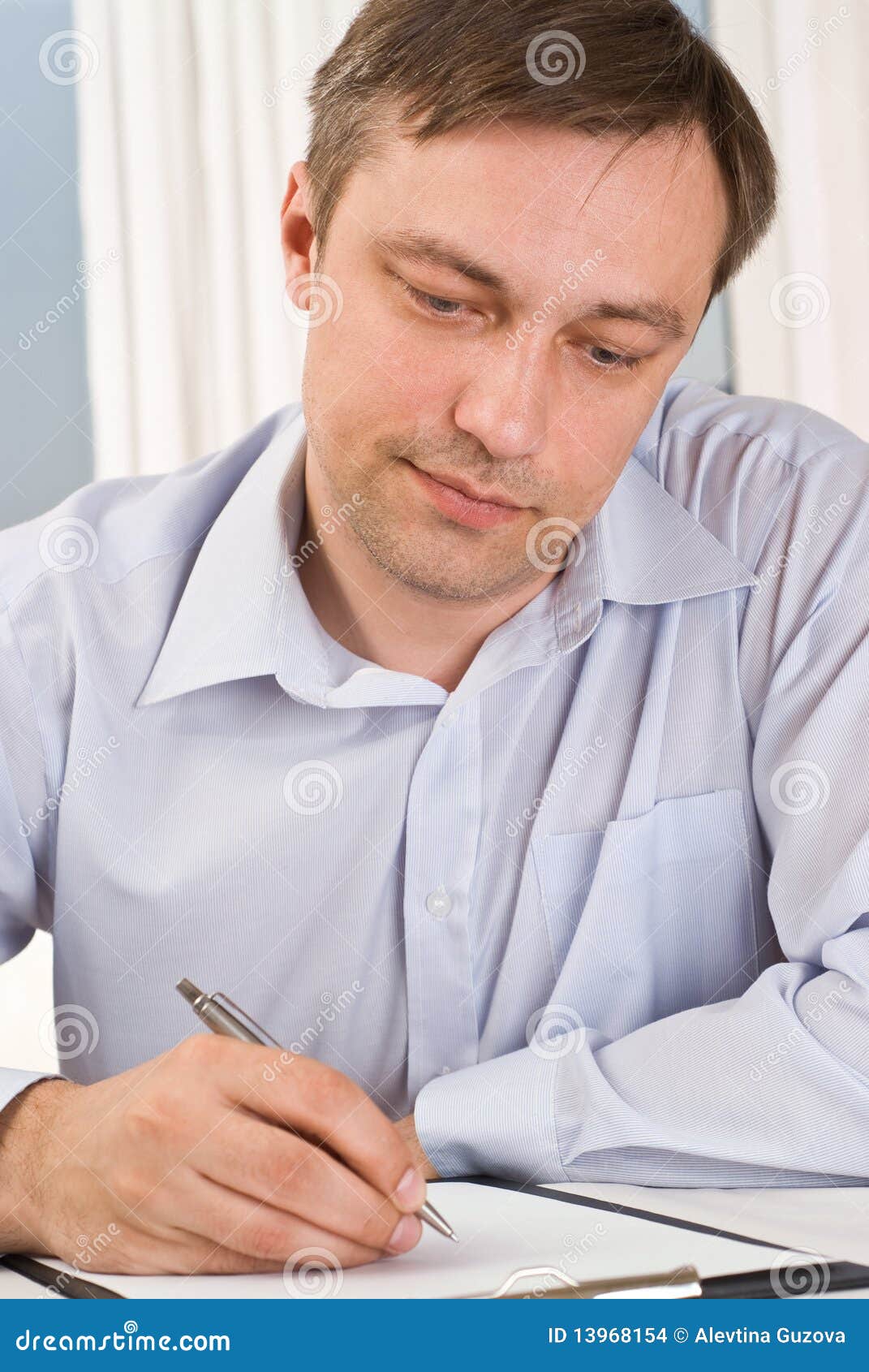 Man sitting at a table stock photo. Image of intelligent - 13968154