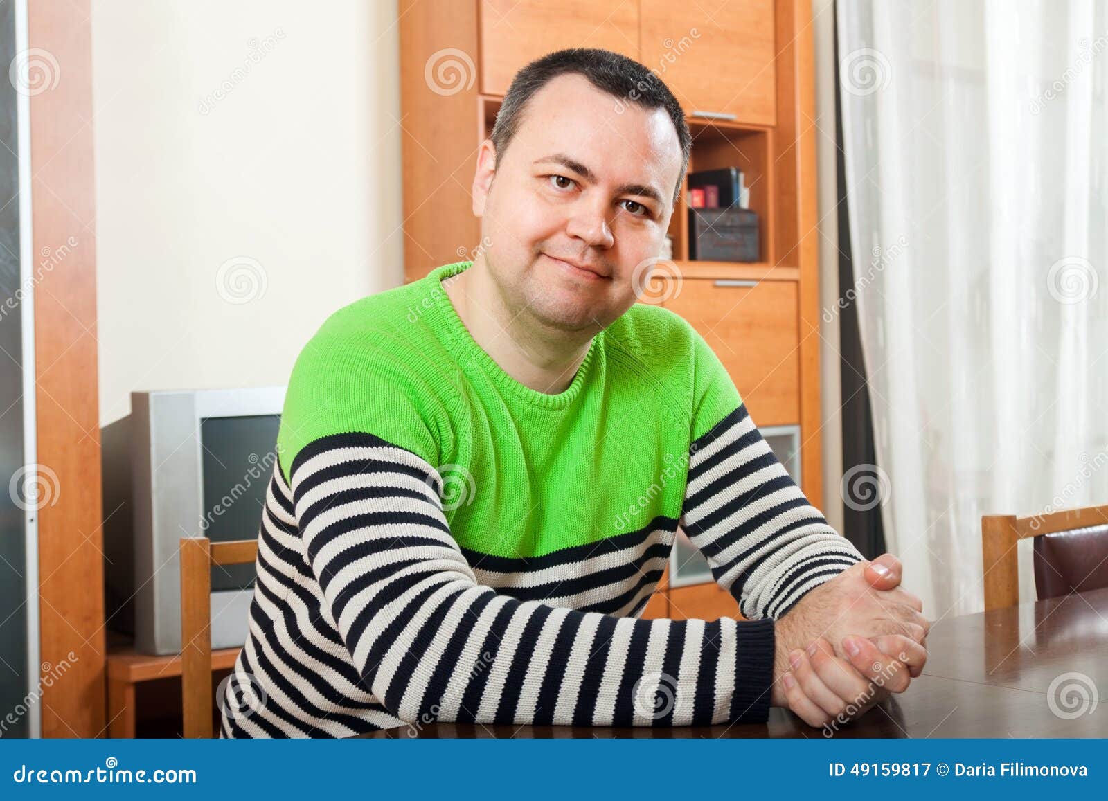 Man sitting at table stock image. Image of calm, camera - 49159817