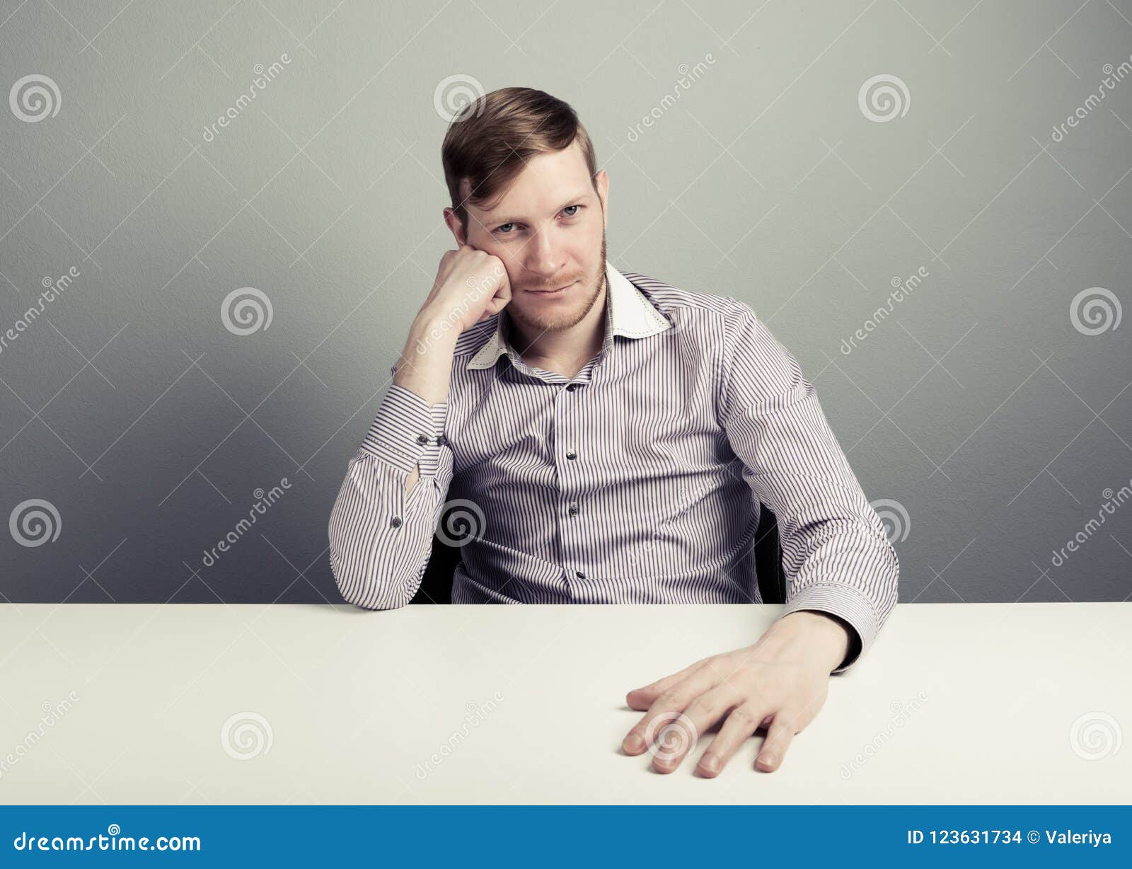 Man sitting at the table stock photo. Image of pensive - 123631734