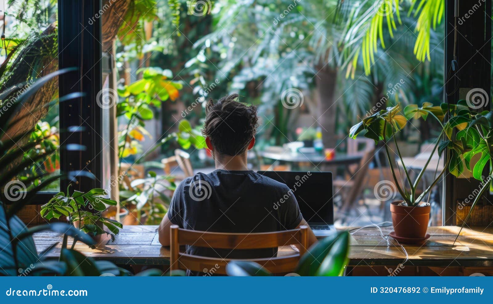 Man Sitting at Table with Laptop Computer Stock Photo - Image of desk ...